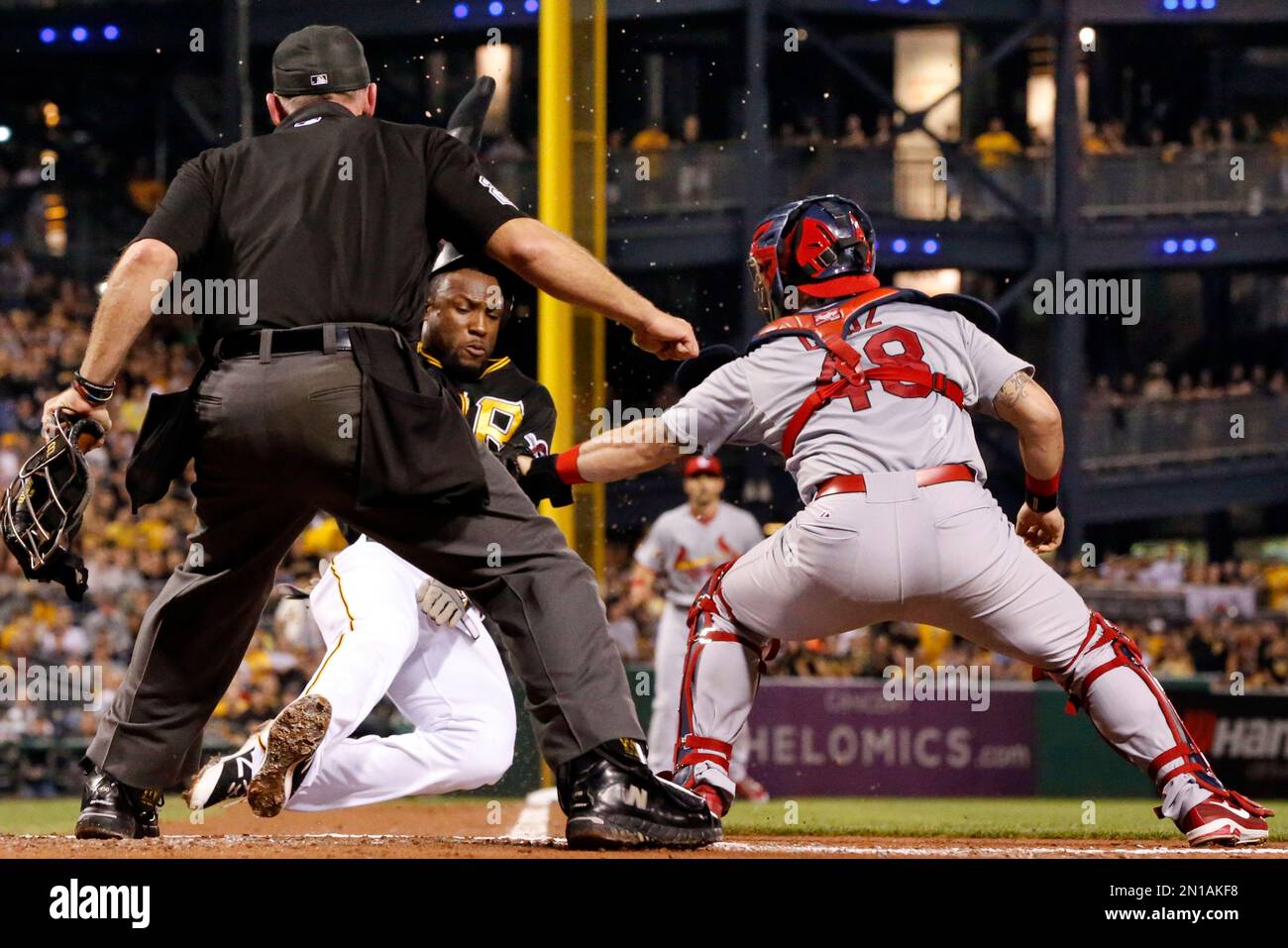 St. Louis Cardinals catcher Tony Cruz, right, tags out Pittsburgh ...