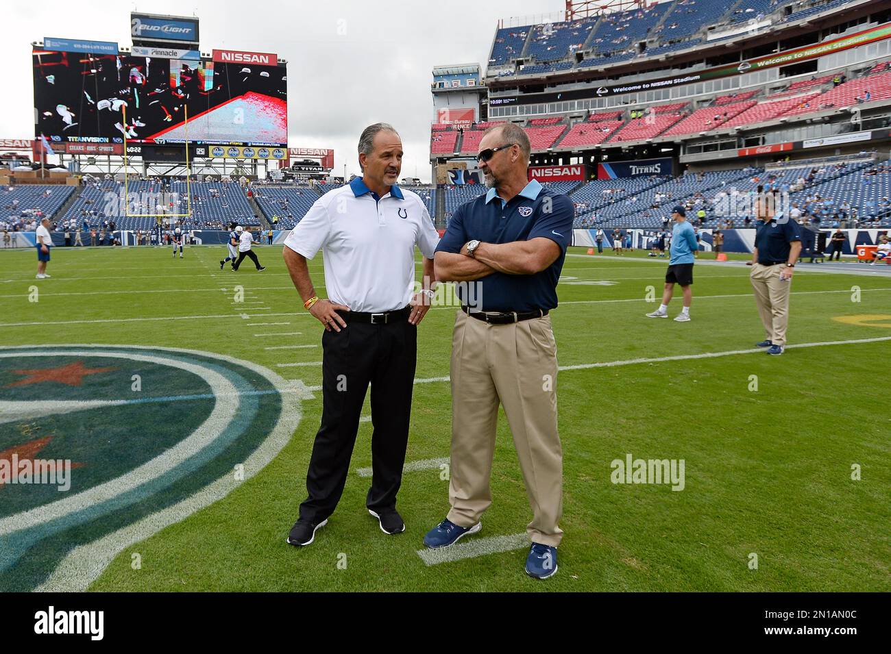 Indianapolis Colts' owner Jim Irsay, left, talks with Colts head coach ...