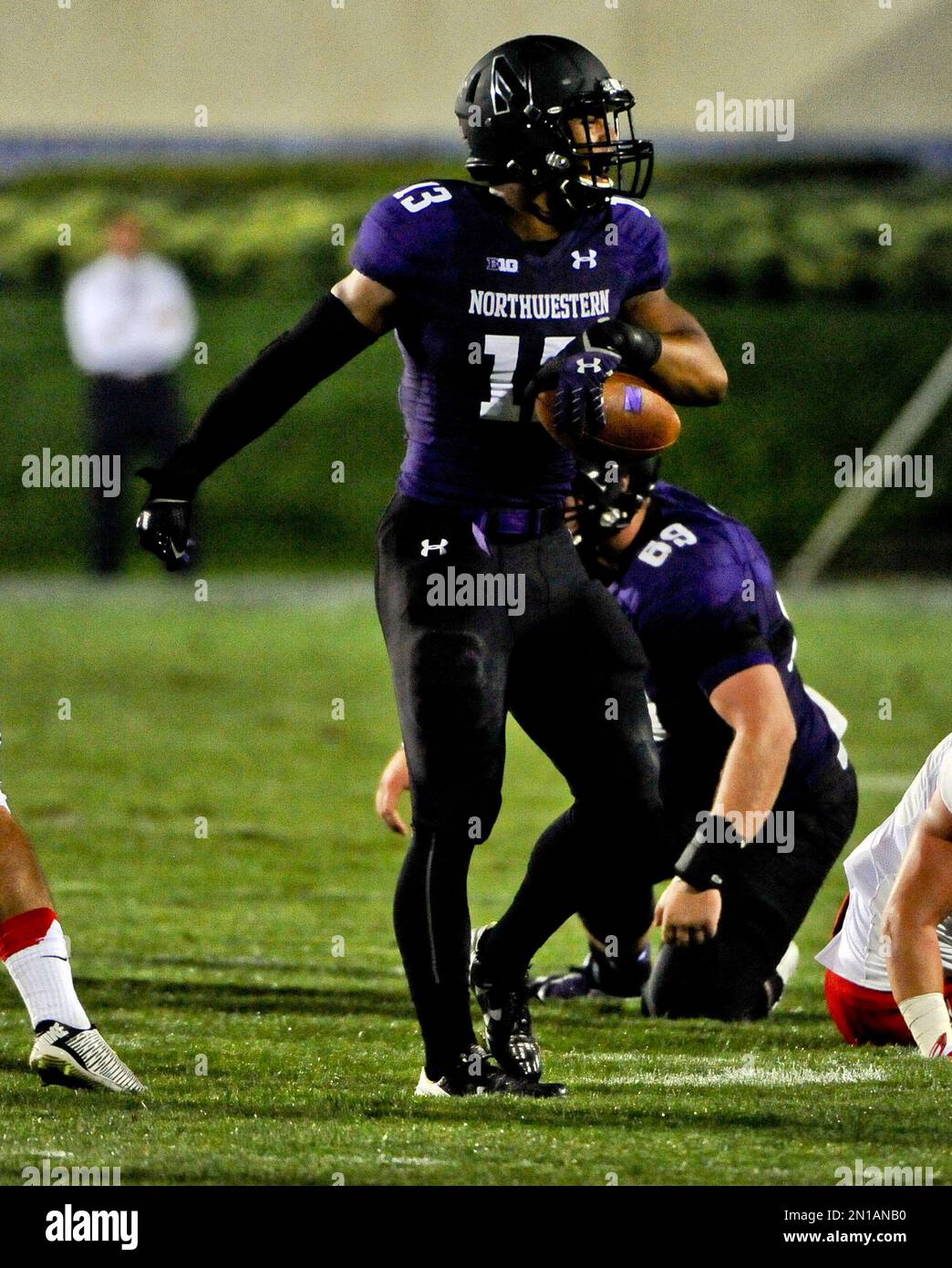 Northwestern running back Warren Long (13) after he drives against Ball ...