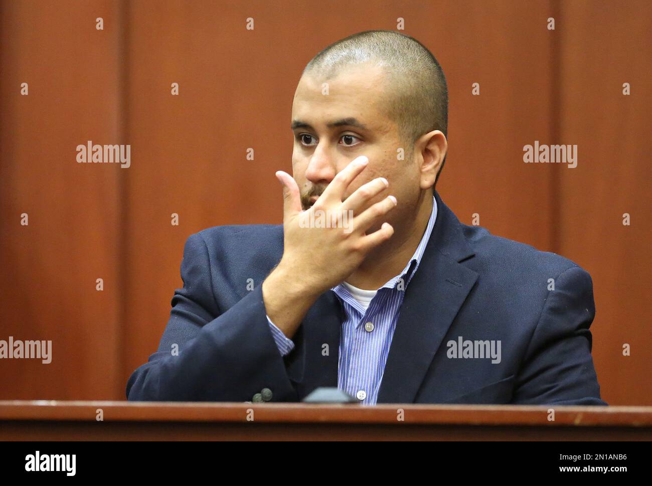 George Zimmerman describes his injuries as he testifies during a ...