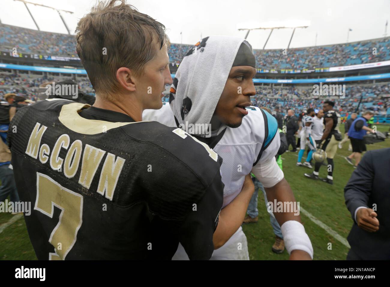 New Orleans Saints' Luke McCown (7) greets Carolina Panthers' Cam ...
