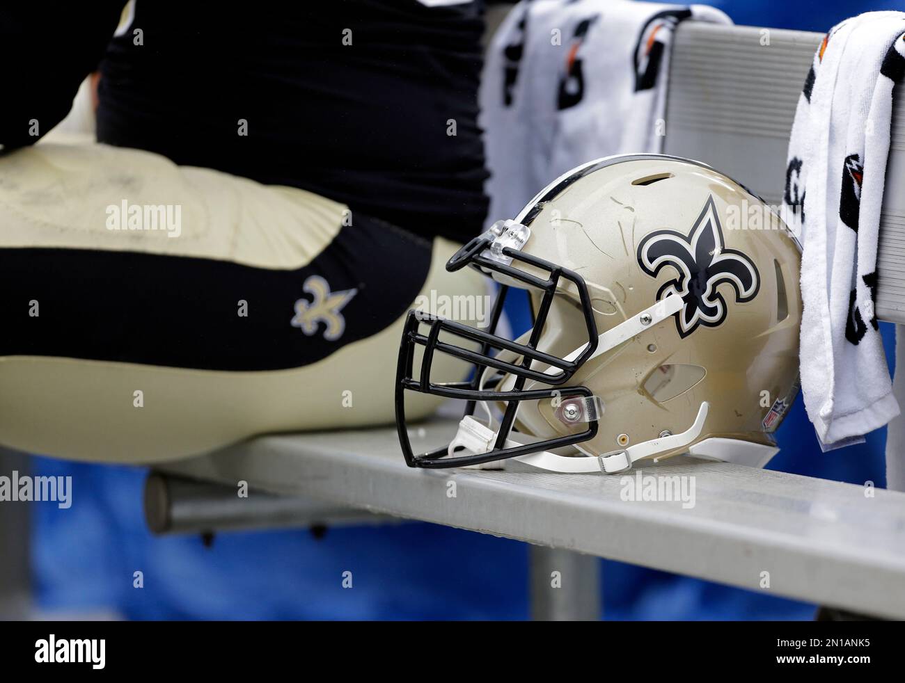A New Orleans Saints' helmet sits on the bench during the first half of ...