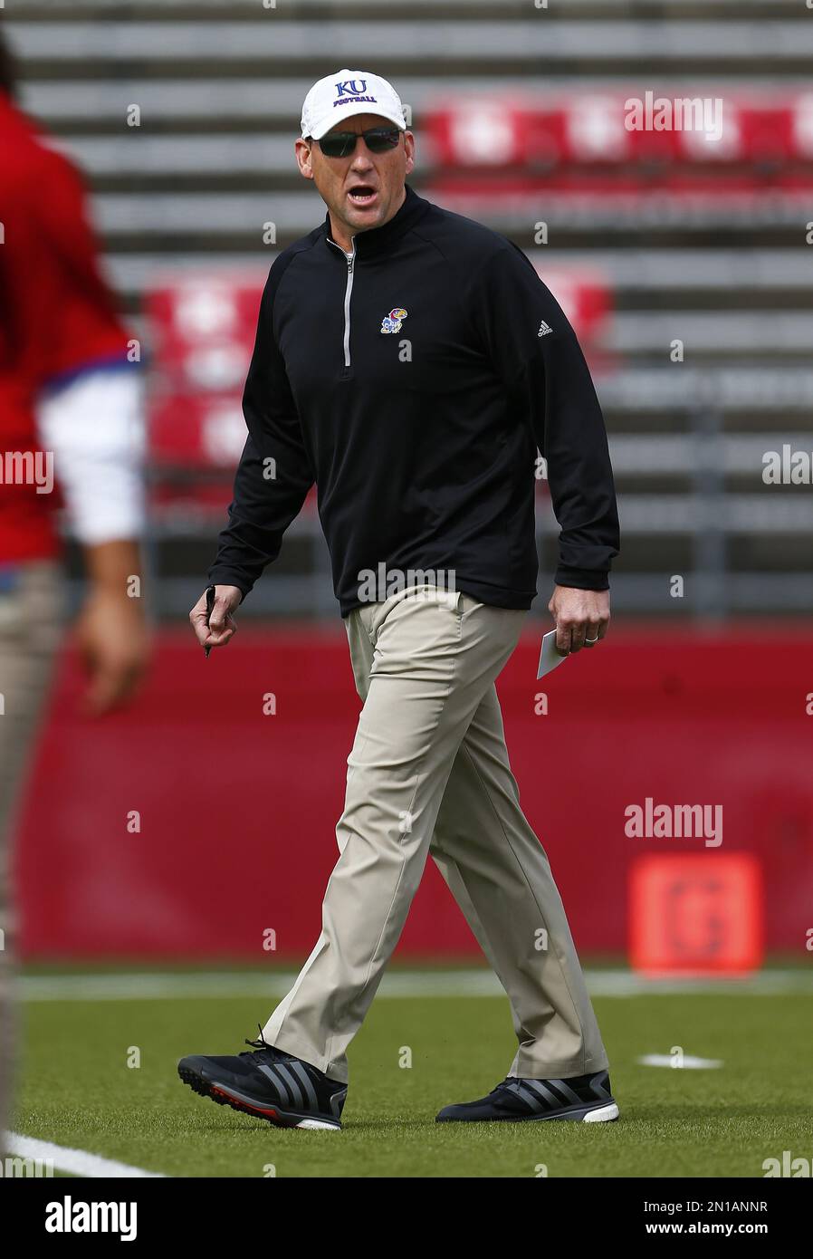 Kansas head coach David Beaty watches warmups before an NCAA college ...