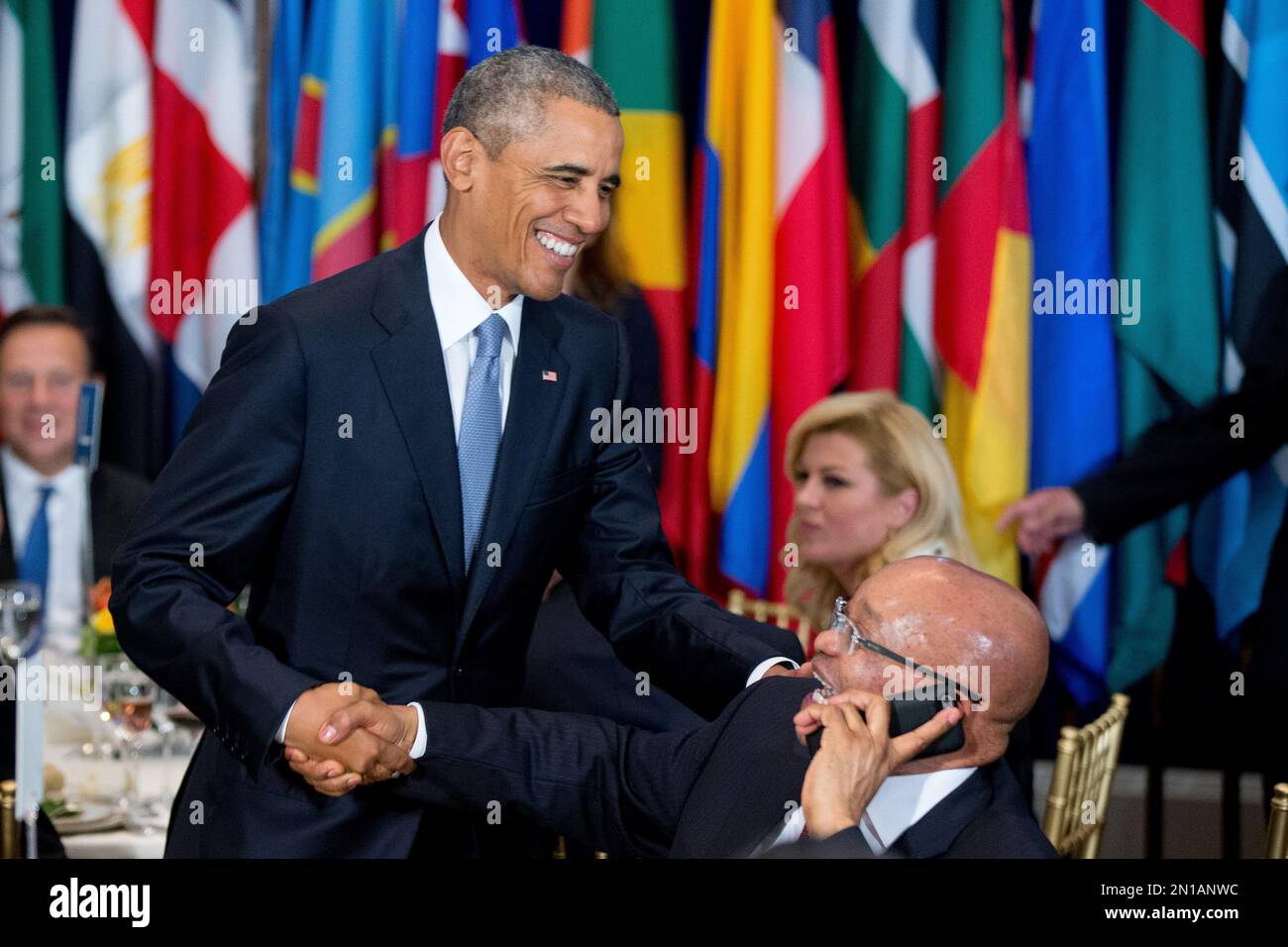 President Barack Obama greets South African President Jacob Zuma, right ...