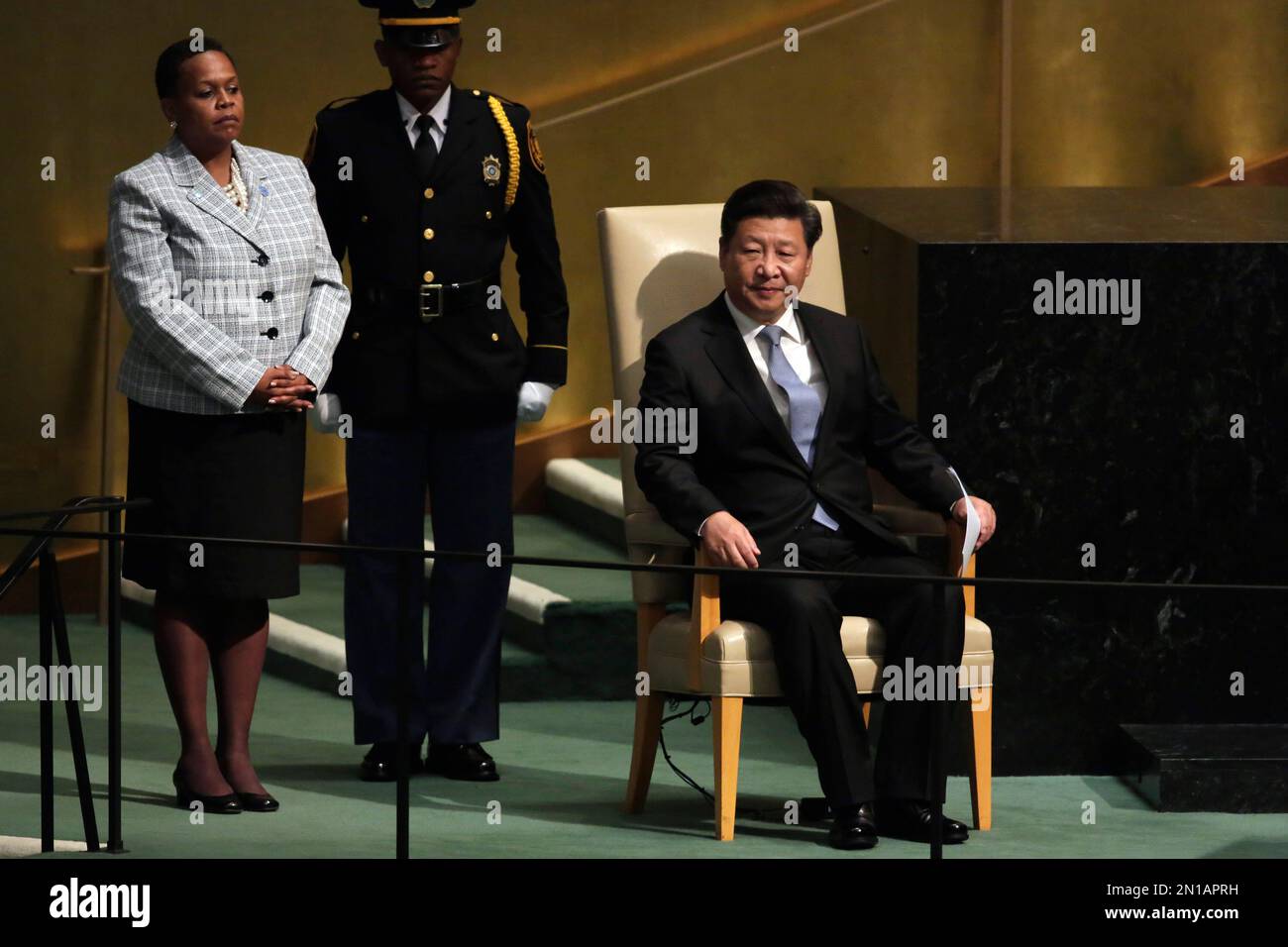China's President Xi Jinping listens to applause after his address to ...