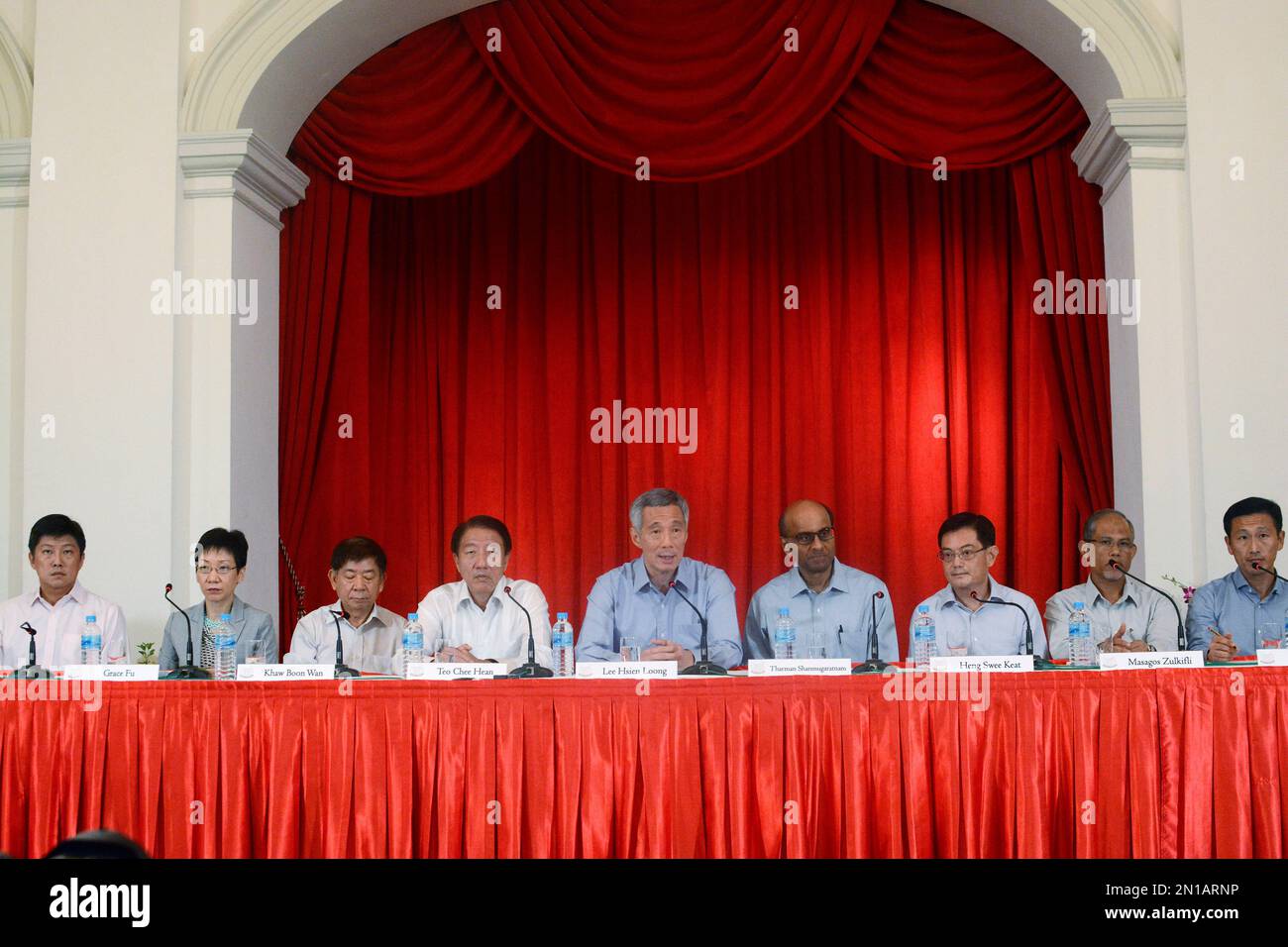 Singapore's Prime Minister Lee Hsien Loong, center, is seated with ...