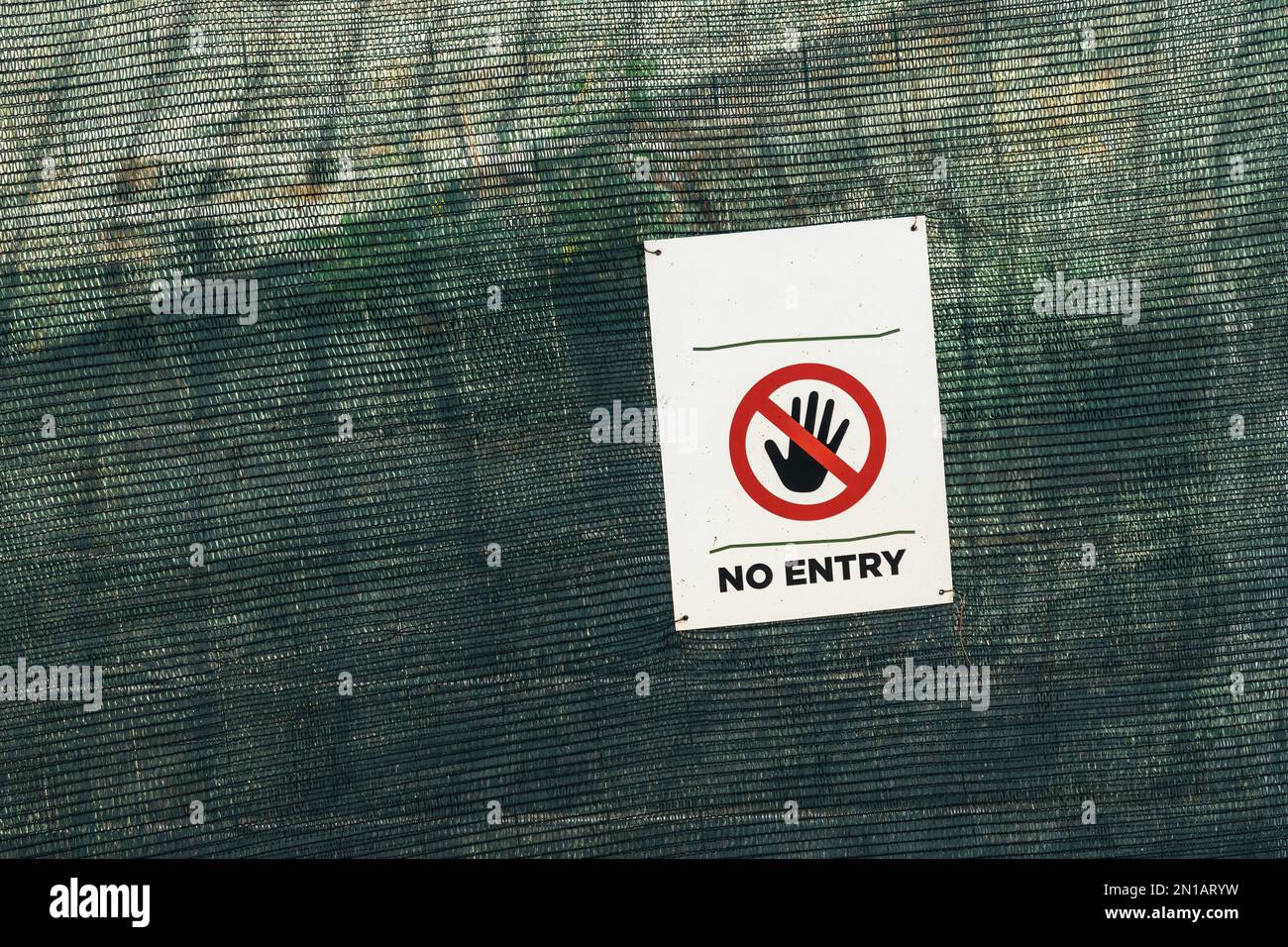No entry sign with Stop hand gesture on fence Stock Photo - Alamy