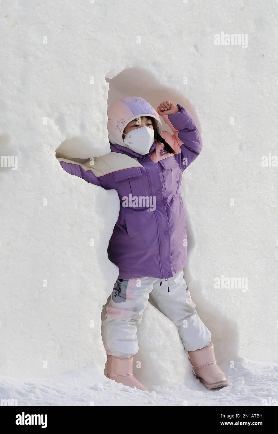 Snow walls are dug with various body postures for tourists to take ...