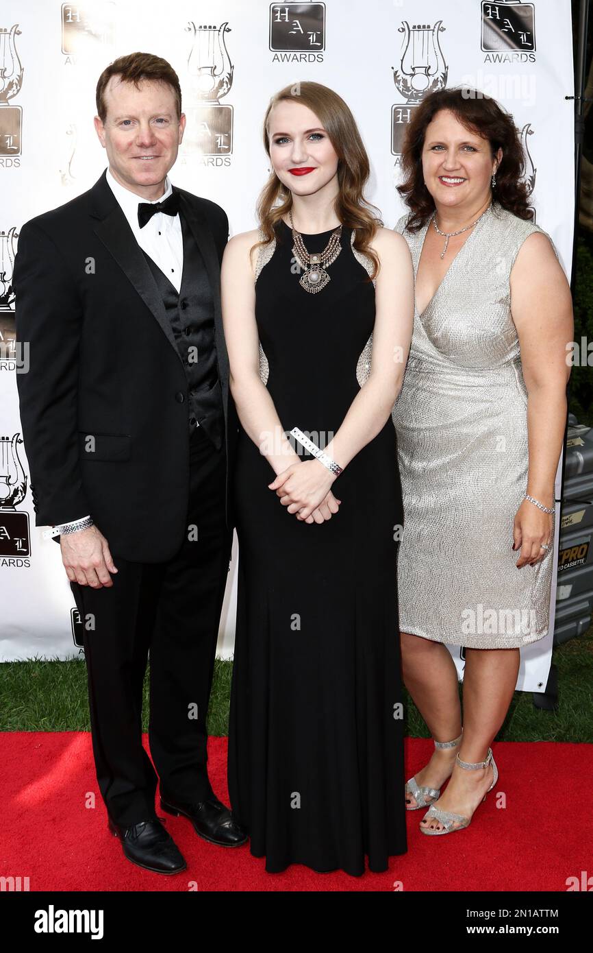 Heather Faulkner, center, and parents attend the 26th Annual Heroes and ...