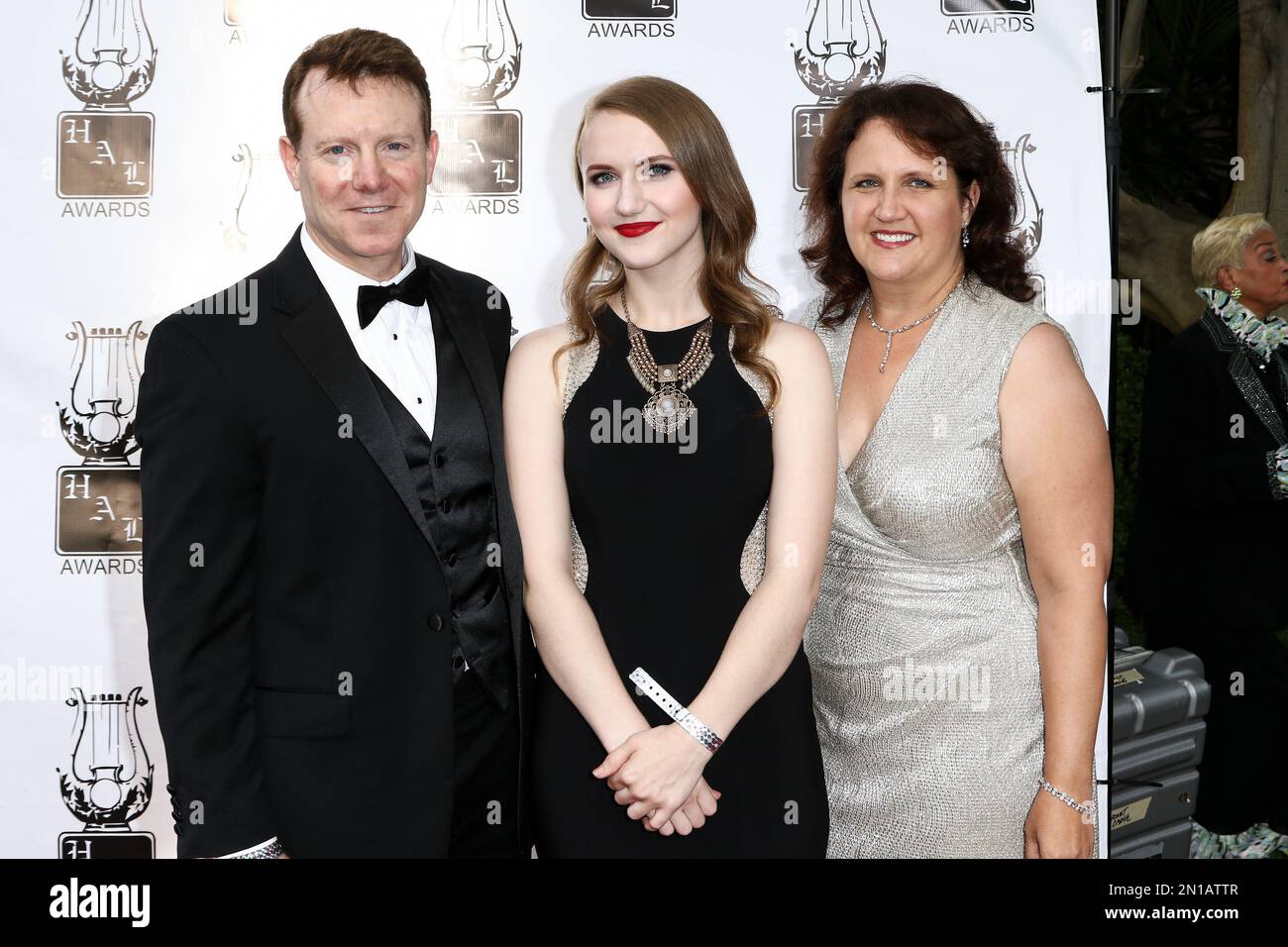 Heather Faulkner, center, and parents attend the 26th Annual Heroes and ...