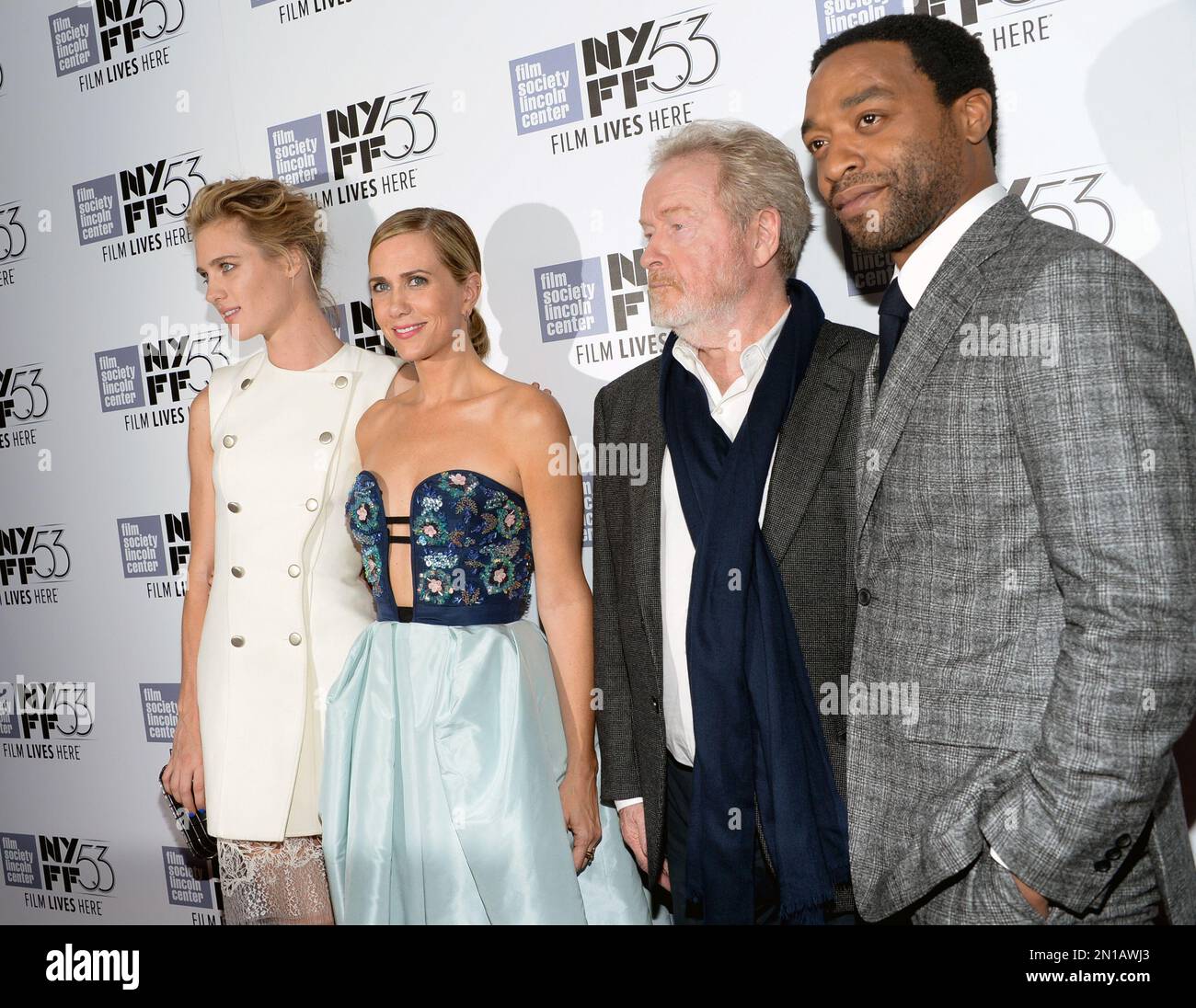 Actors Mackenzie Davis, left, and Kristen Wiig pose with director ...