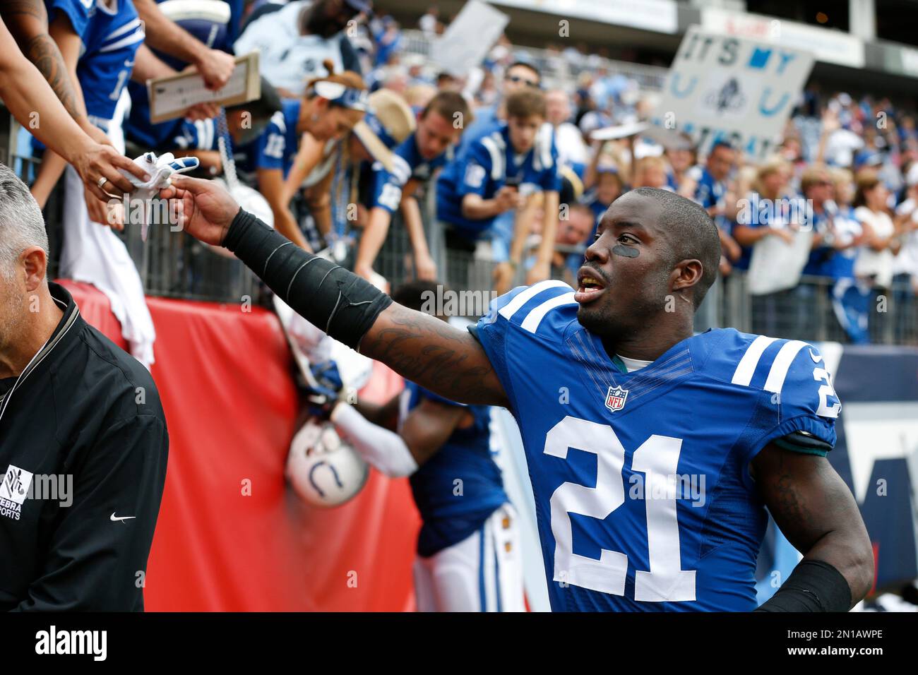 Indianapolis Colts cornerback Vontae Davis (21) gives his gloves to a ...