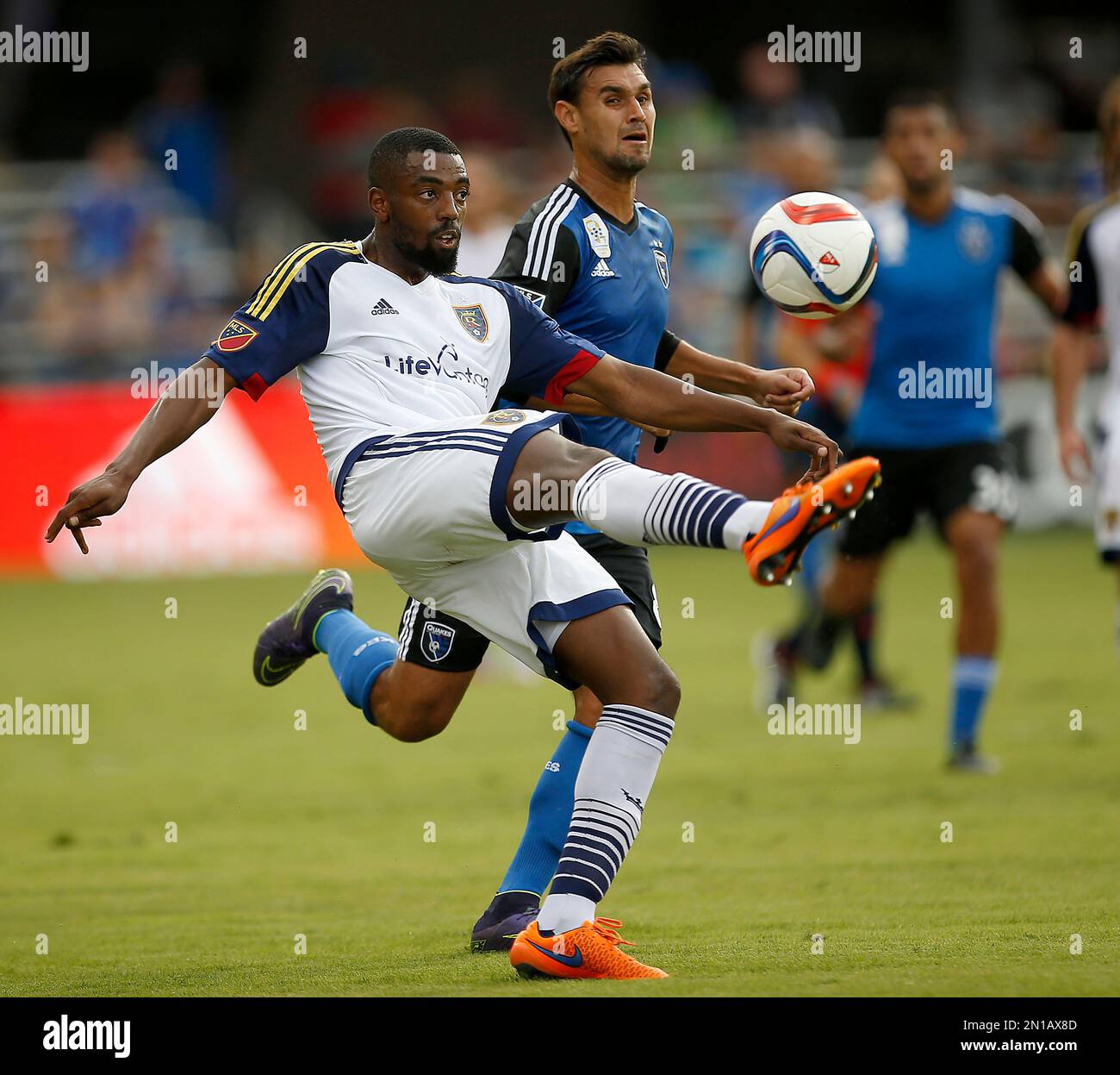 Real Salt Lake defender Aaron Maund, left, battles for the ball against ...