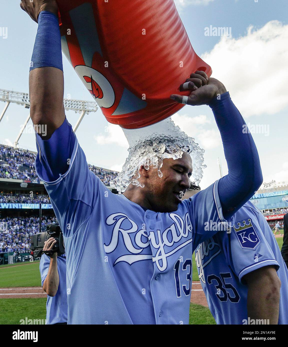 Kansas City Royals' Salvador Perez douses himself and Eric Hosmer after ...