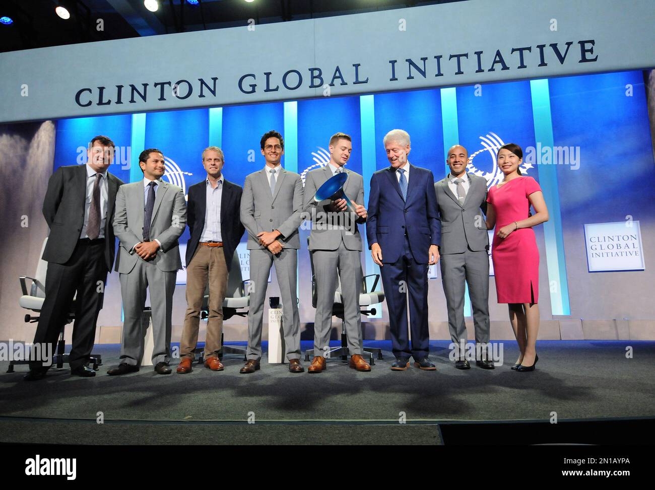 Former U.S. President Bill Clinton, third from right, recognizes ...