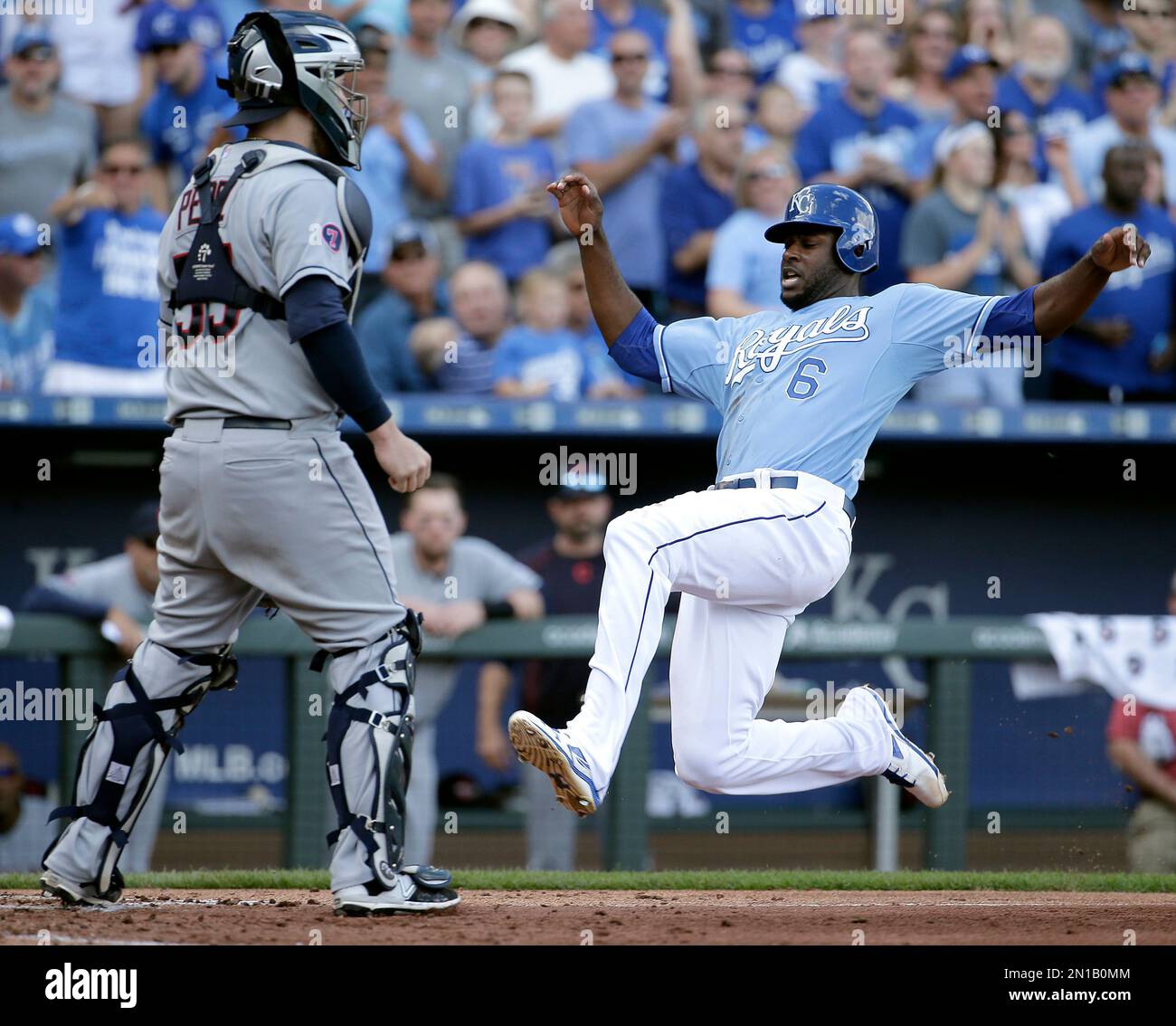 Kansas City Royals' Lorenzo Cain slides home past Cleveland Indians ...