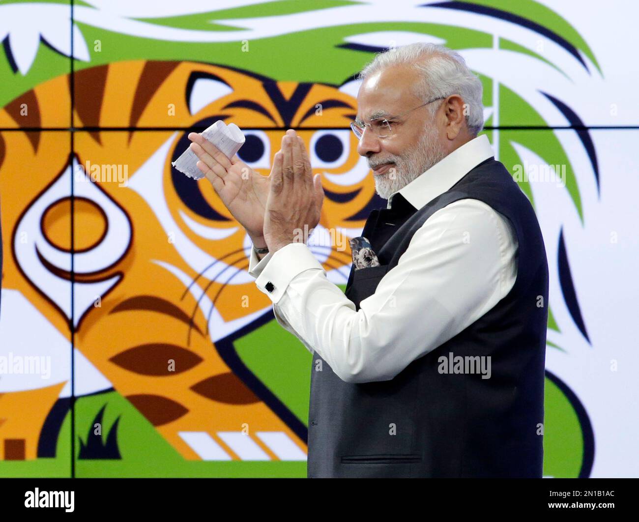 Prime Minister of India Narendra Modi joins the crowd in applause ...