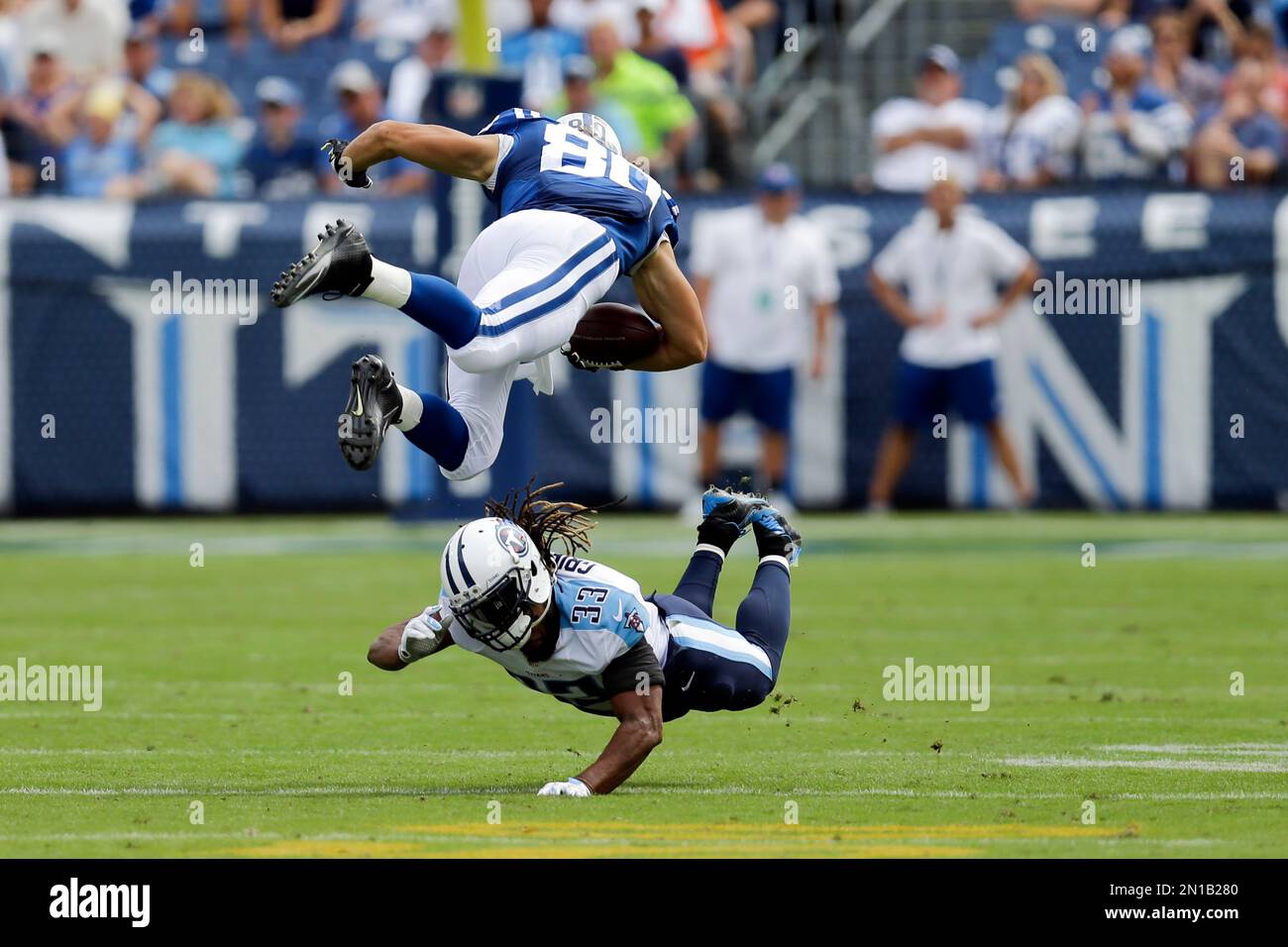 Indianapolis Colts tight end Coby Fleener (80) is upended by Tennessee ...