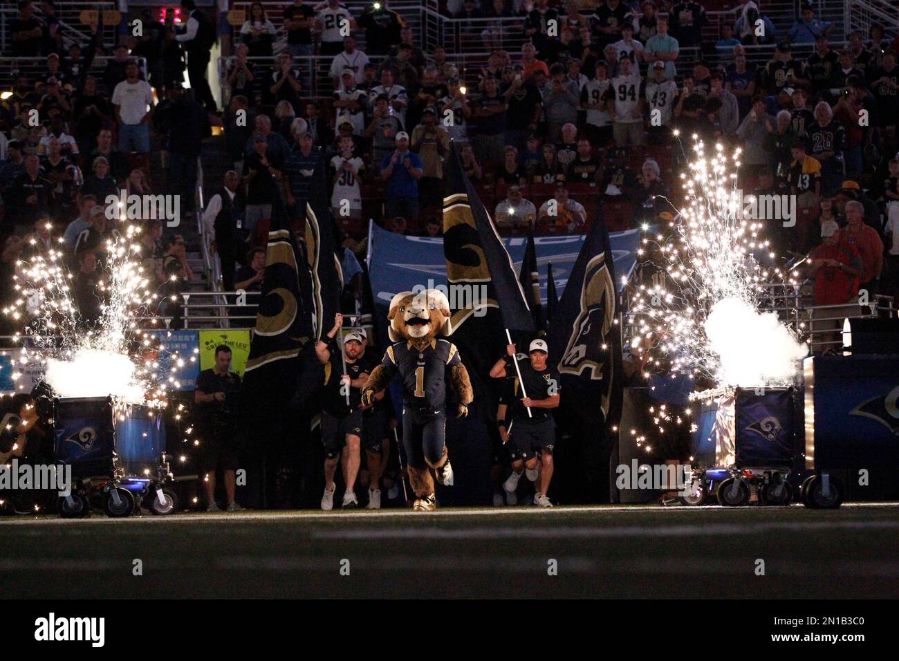 St. Louis Rams mascot Rampage runs on the field before the start of an ...