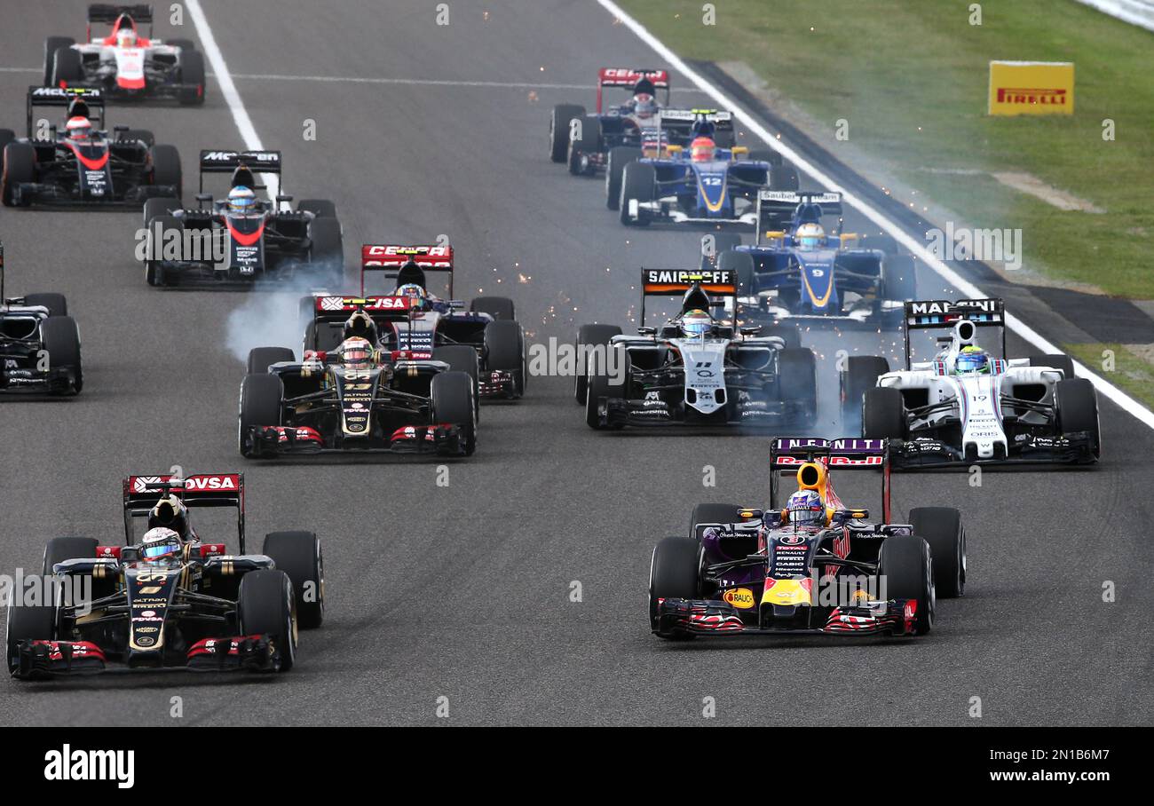 Cars race to turn one at the start of the Japanese Formula One Grand ...