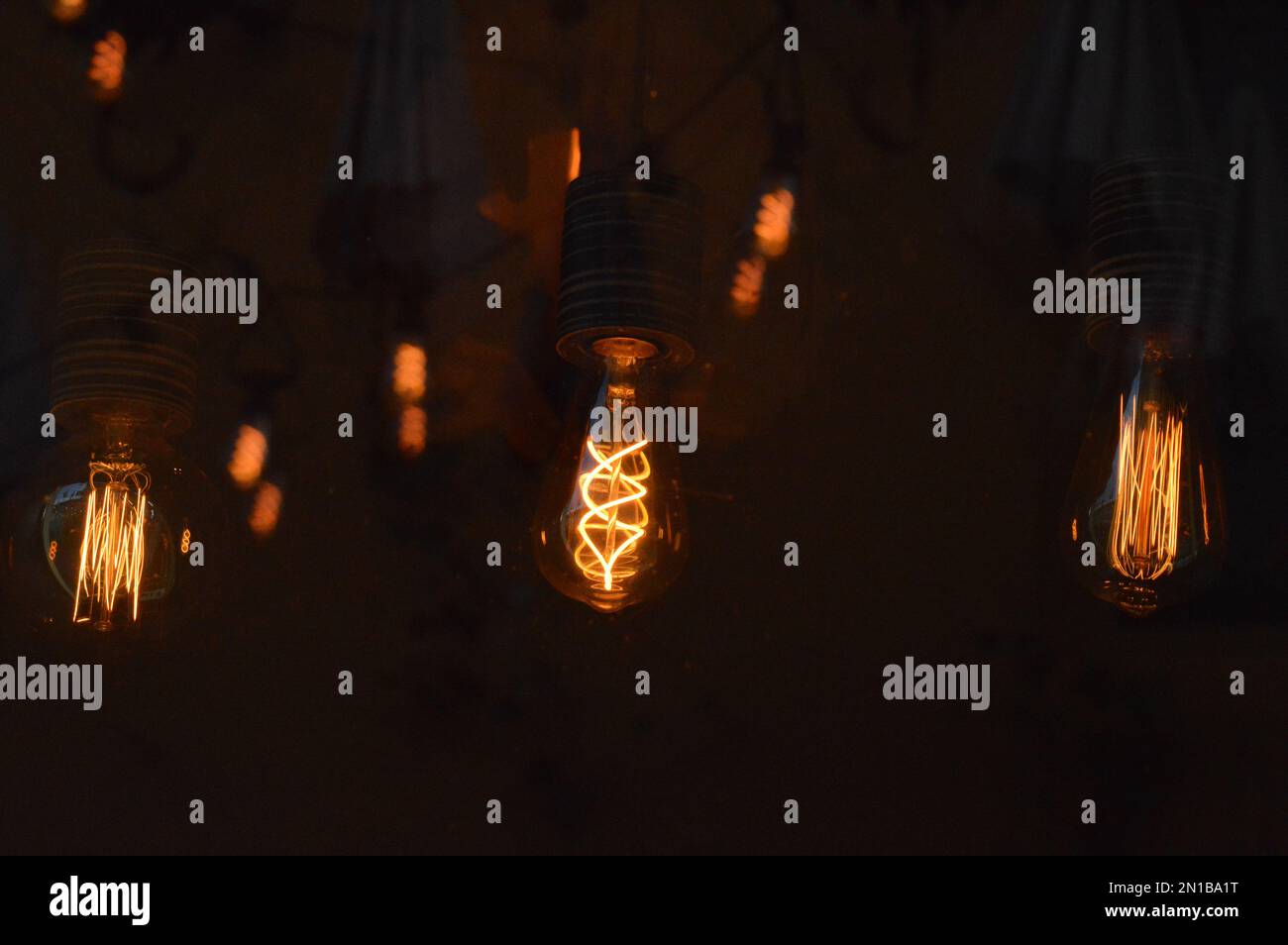 Light bulbs through a window Stock Photo - Alamy