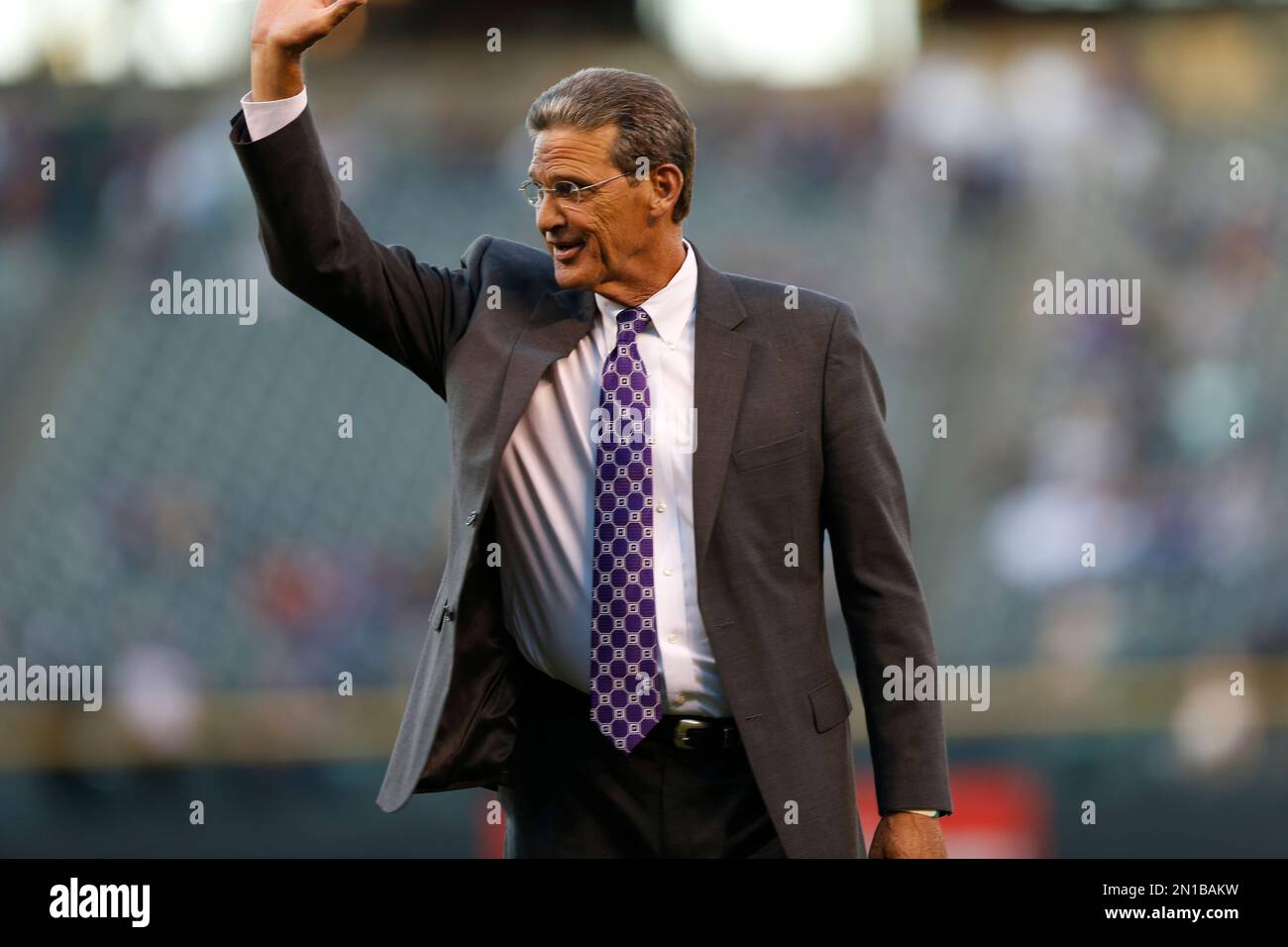 Colorado Rockies television color analyst George Frazier waves to crowd ...