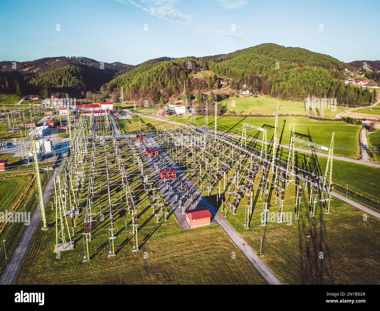 Electrical substation in the suburbs, fields and forest in the ...