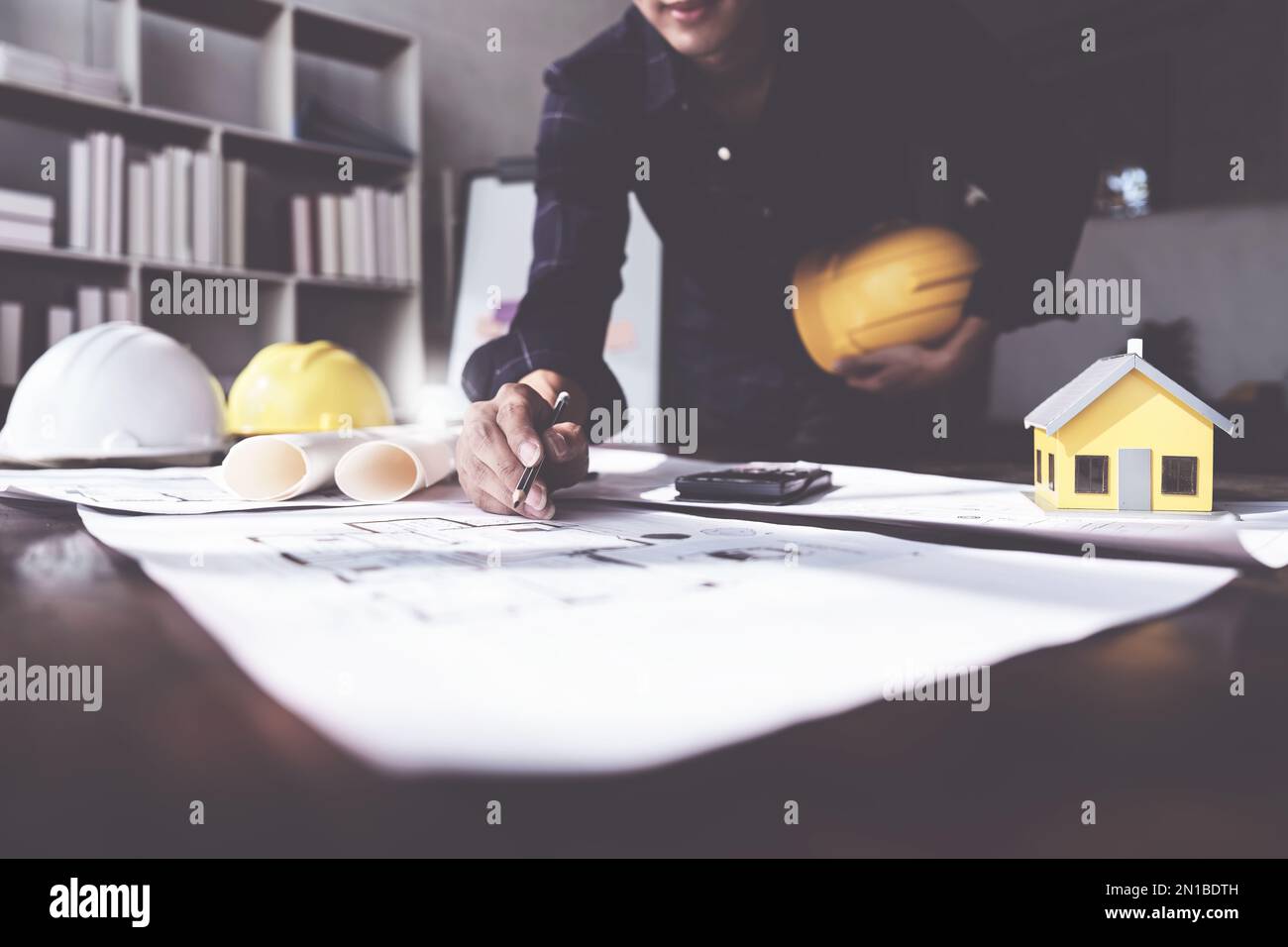 Architecture or Civil engineer analyze with construction blueprint ...