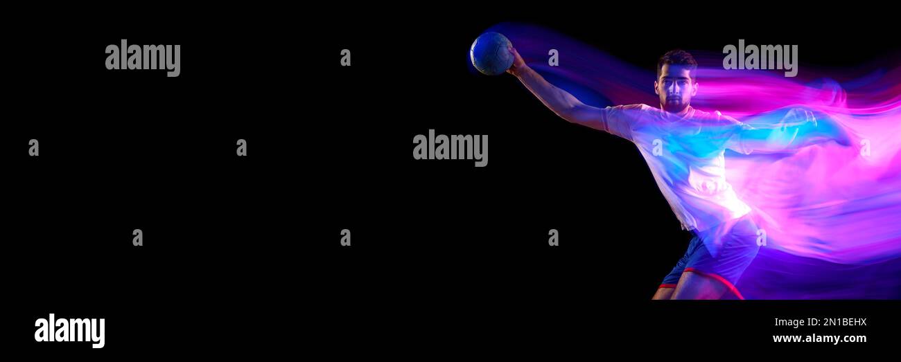 Motivation. Young man, professional handball player in motion, playing ...