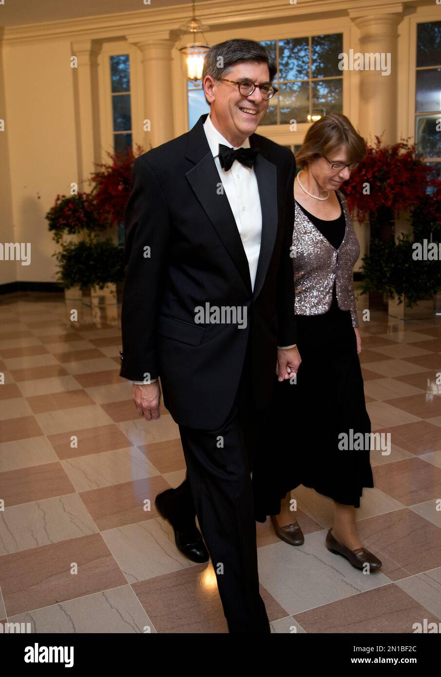 Treasury Secretary Jacob Lew and his wife Ruth Schwartz, arrive for a ...