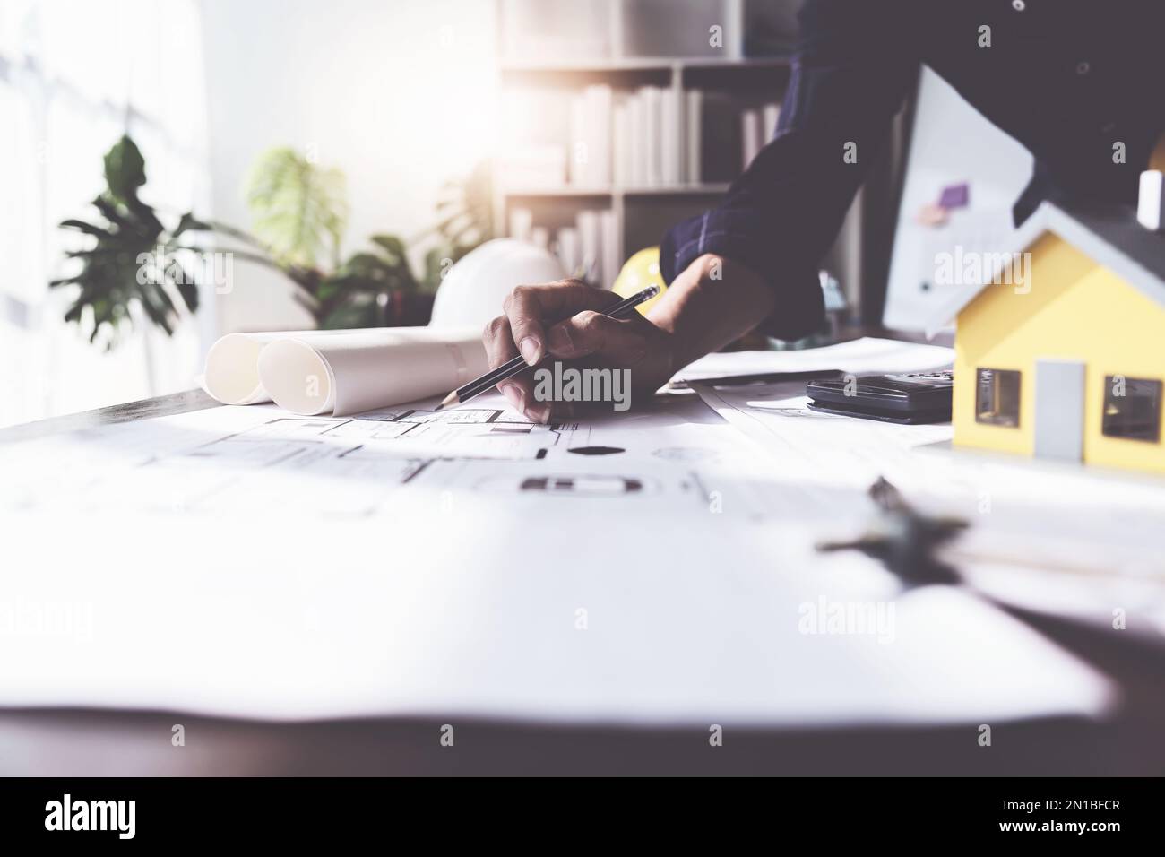 Architecture or Civil engineer analyze with construction blueprint ...