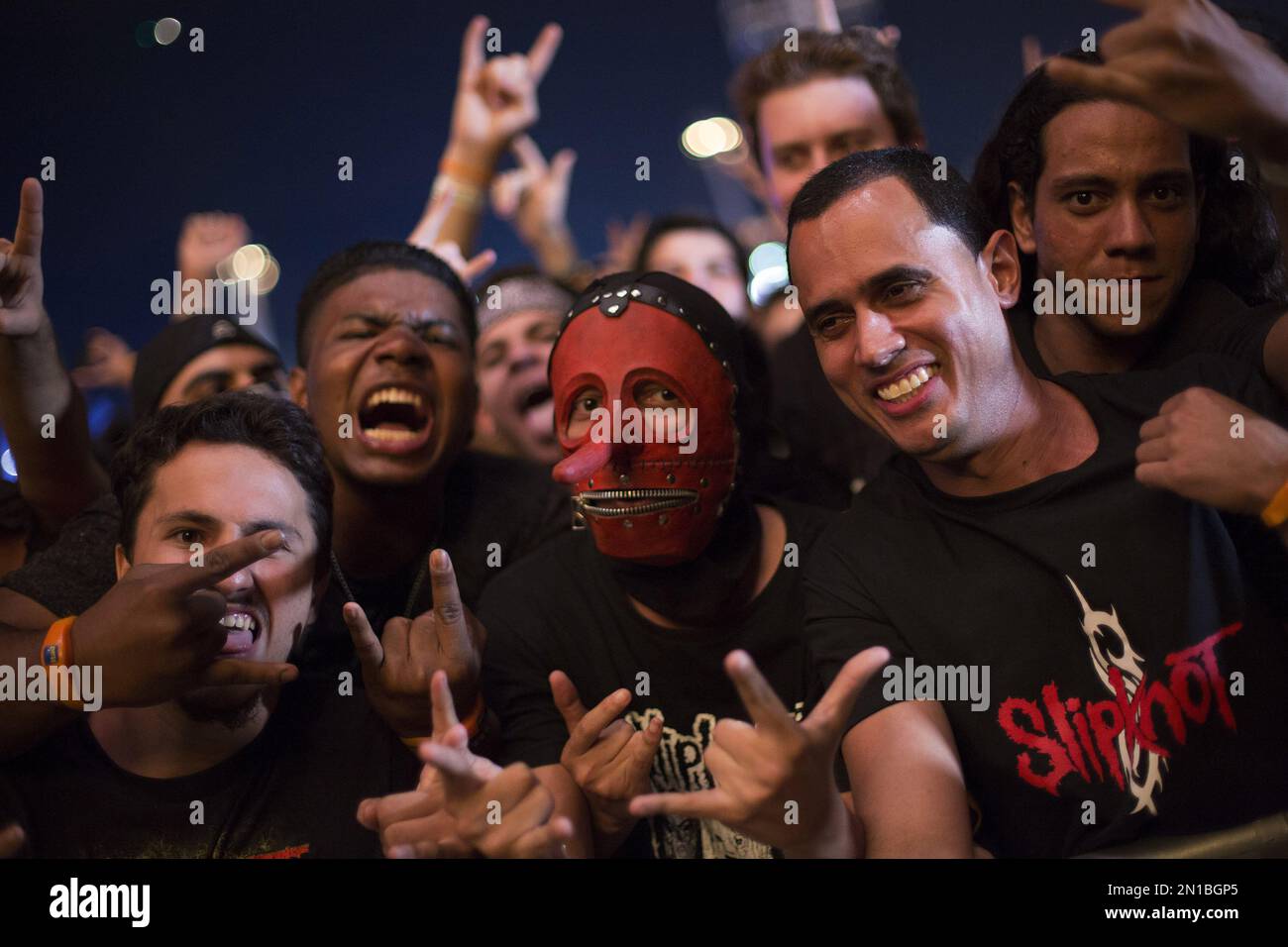Fans of the heavy metal group Slipknot pose for the picture as they ...