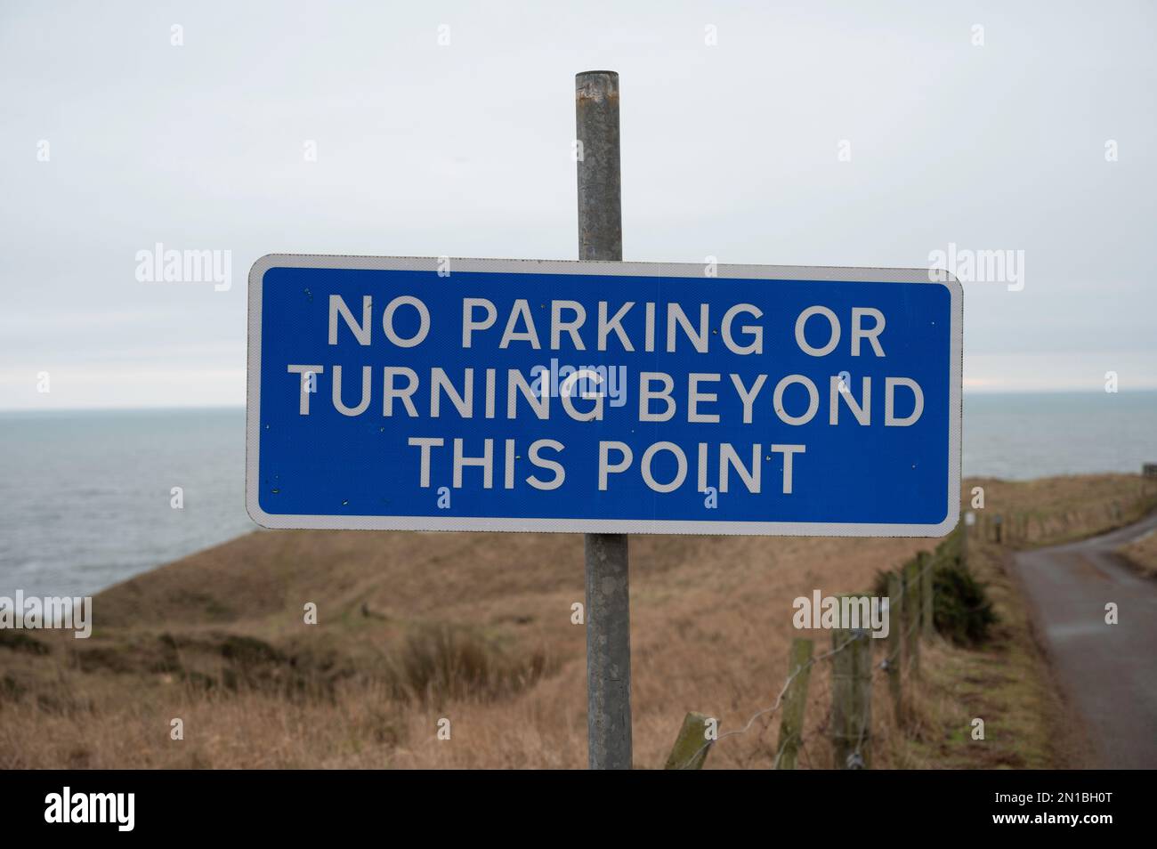 Sign No Parking or Turning Beyond this Point. Blurred background of ...