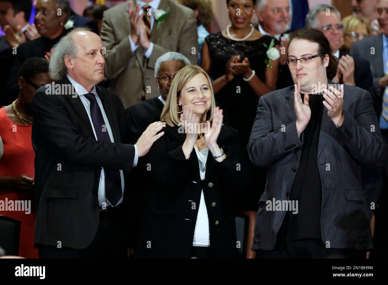 Nashville Mayor Megan Barry is applauded by her husband, Bruce, left ...