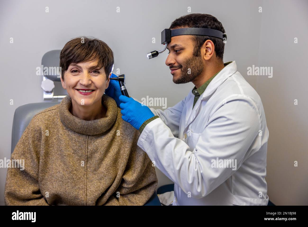 Senior woman having hearing checkup at ent doctor Stock Photo - Alamy