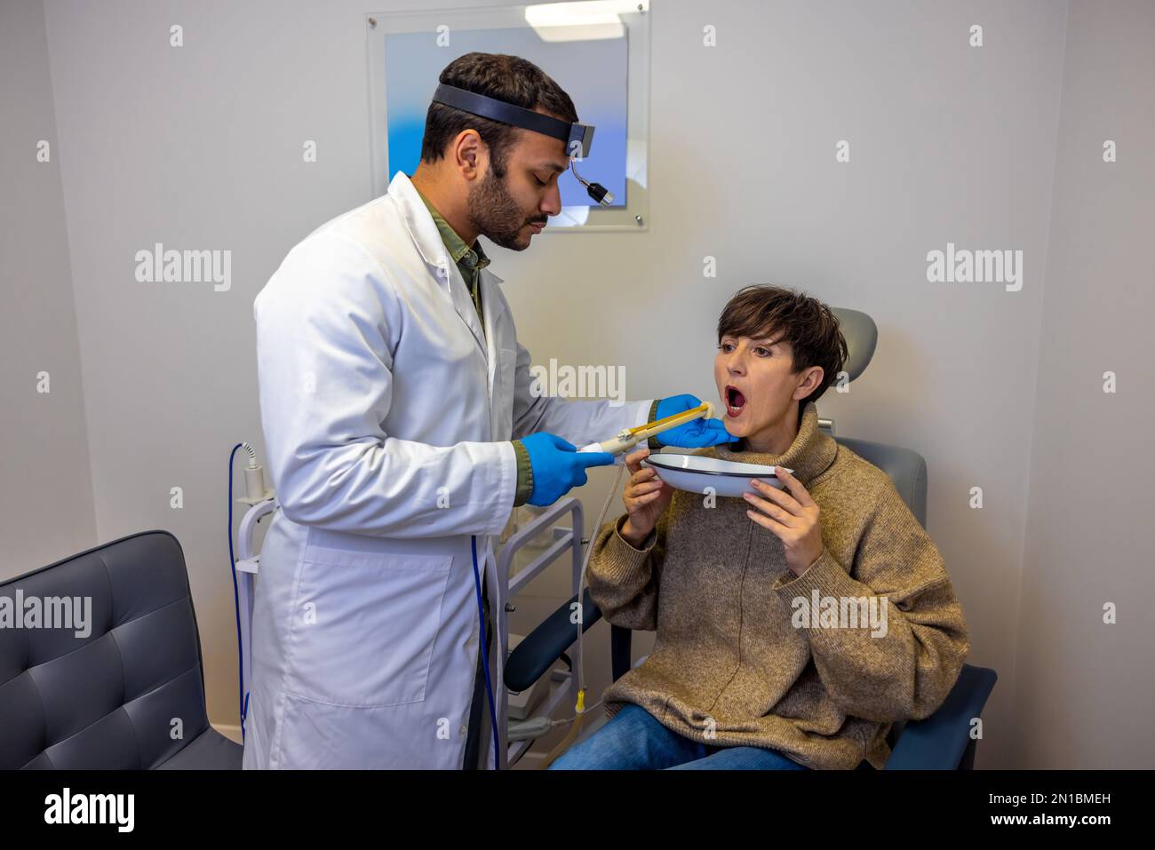 Senior woman having larynx checkup at ent doctor Stock Photo - Alamy