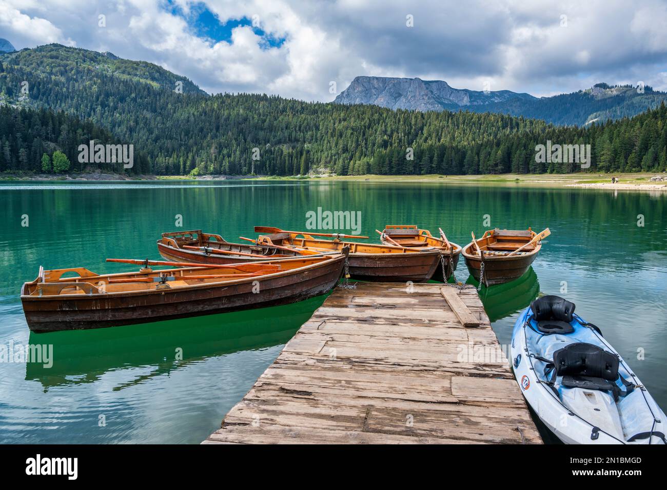 Rowing boats and canoes on the Black Lake (Crno Jezero) in Durmitor ...