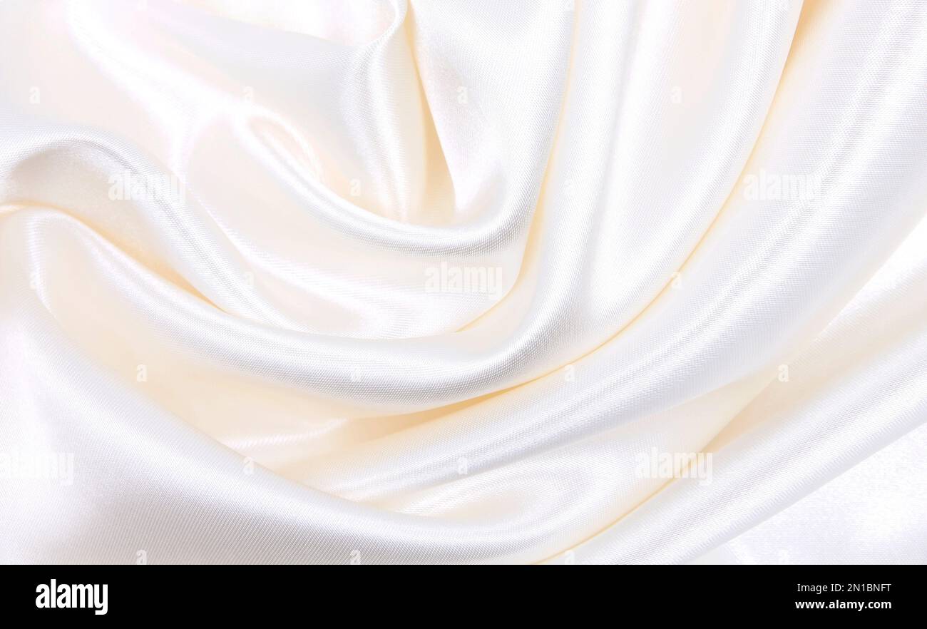 Smooth elegant white silk or satin luxury cloth texture can use as ...