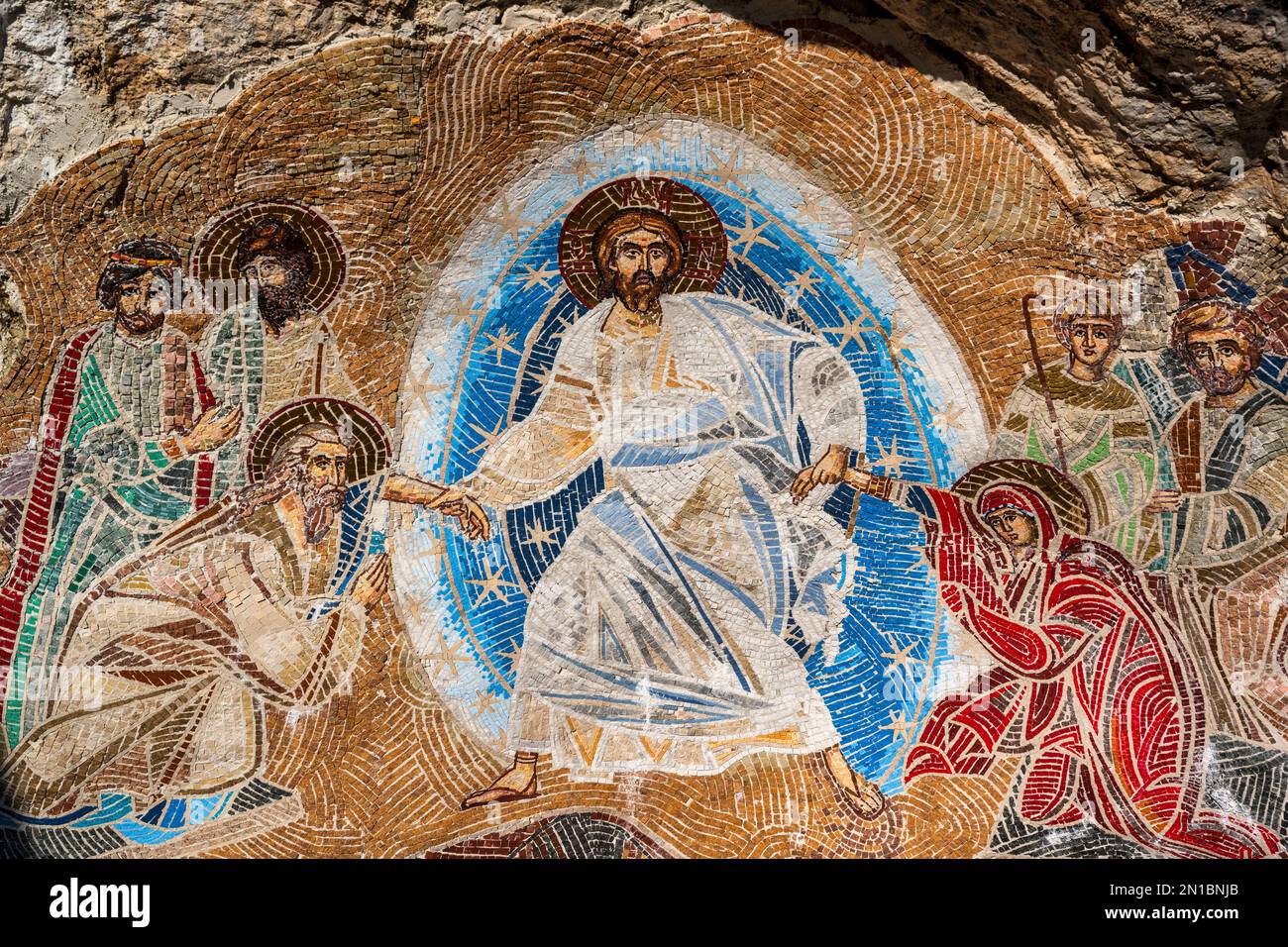 Mosaic depicting religious scene on rock face in interior of Church of ...