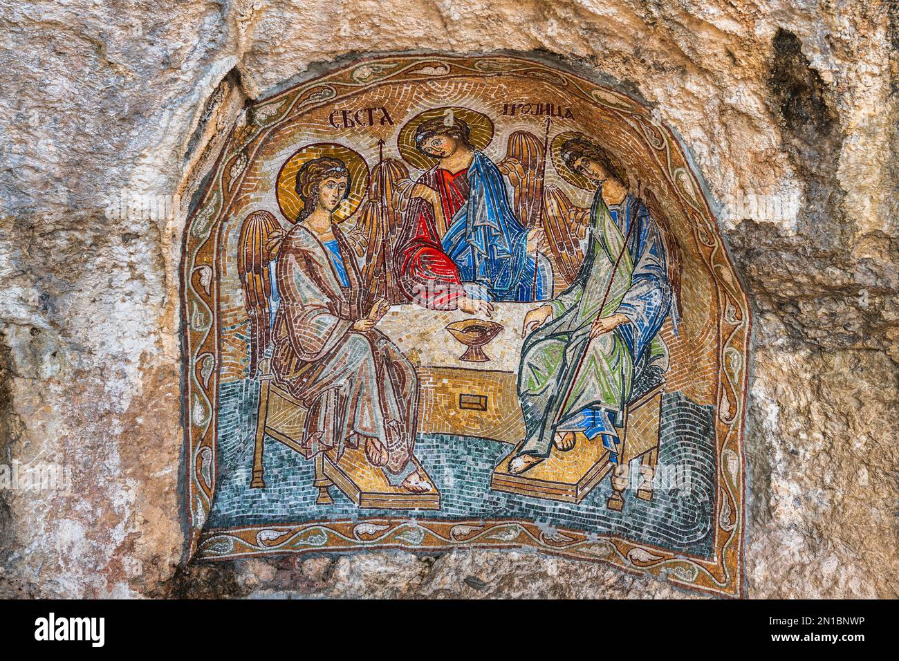 Mosaic depicting religious scene on rock face in interior of Church of ...