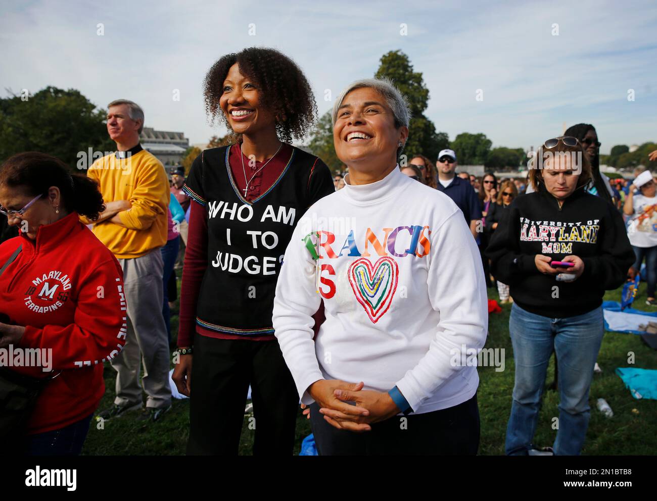 Ikeita Cantu of McLean, Va., left, stands alongside her wife, Carmen ...