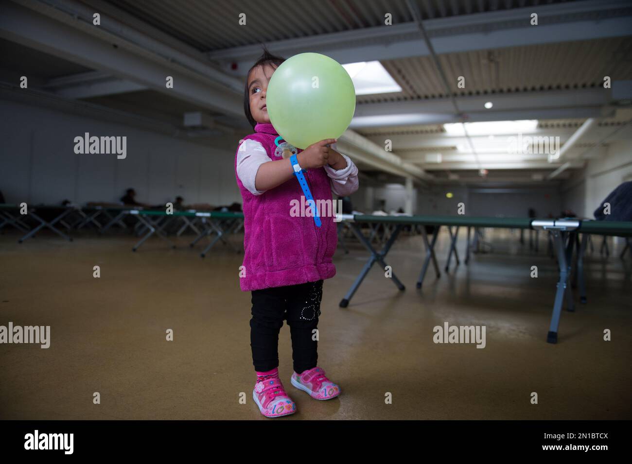 A migrant girls plays with a ballon during the Muslim holiday of Eid al ...