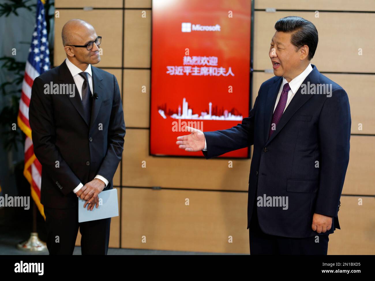 Chinese President Xi Jinping, right, talks with Microsoft CEO Satya ...