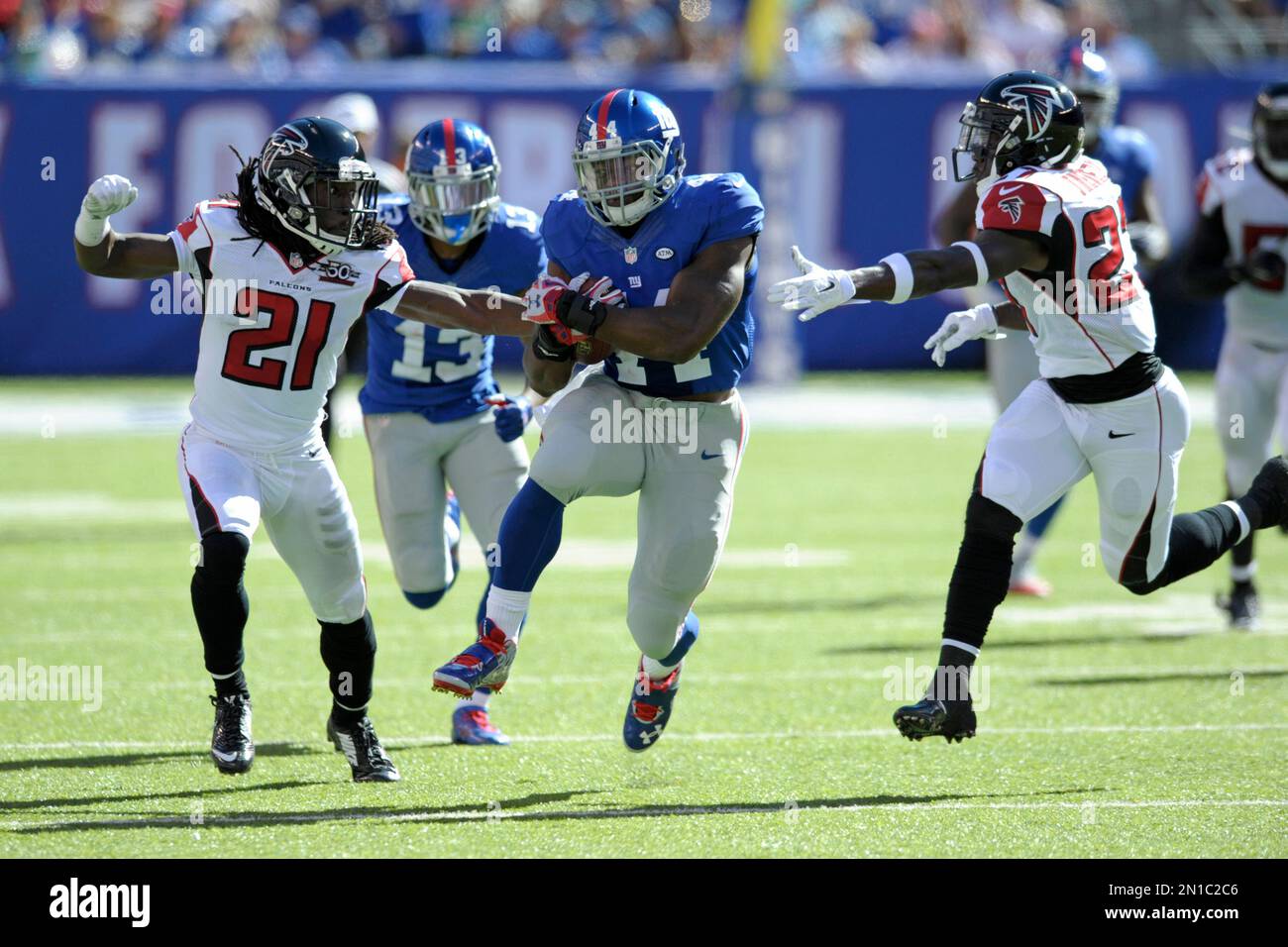 New York Giants running back Andre Williams (44) runs between Atlanta ...