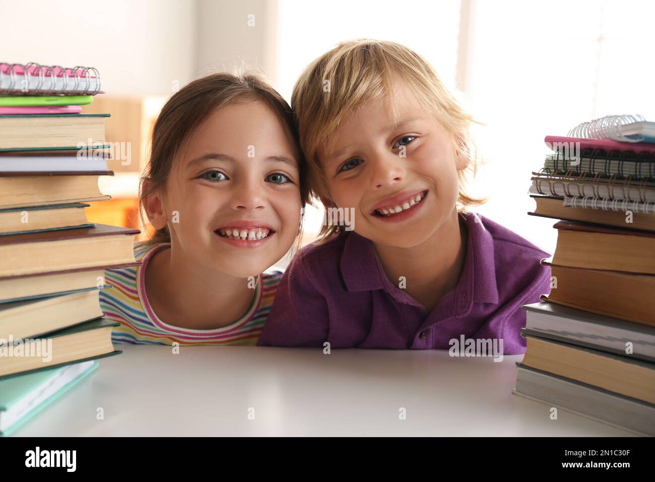 Boy girl doing homework table hi-res stock photography and images - Alamy