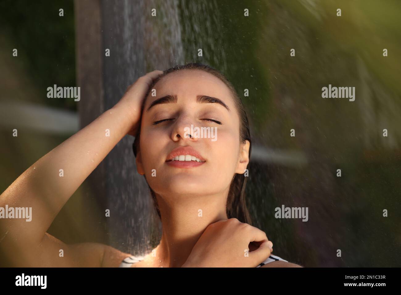 Woman washing hair in outdoor shower on summer day Stock Photo - Alamy