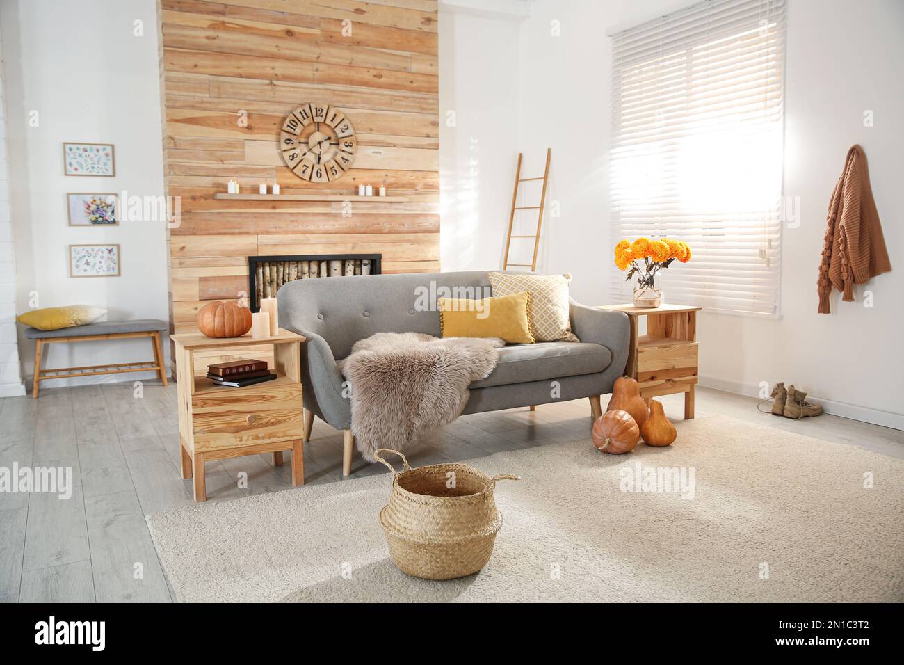 Cozy living room interior inspired by autumn colors Stock Photo - Alamy
