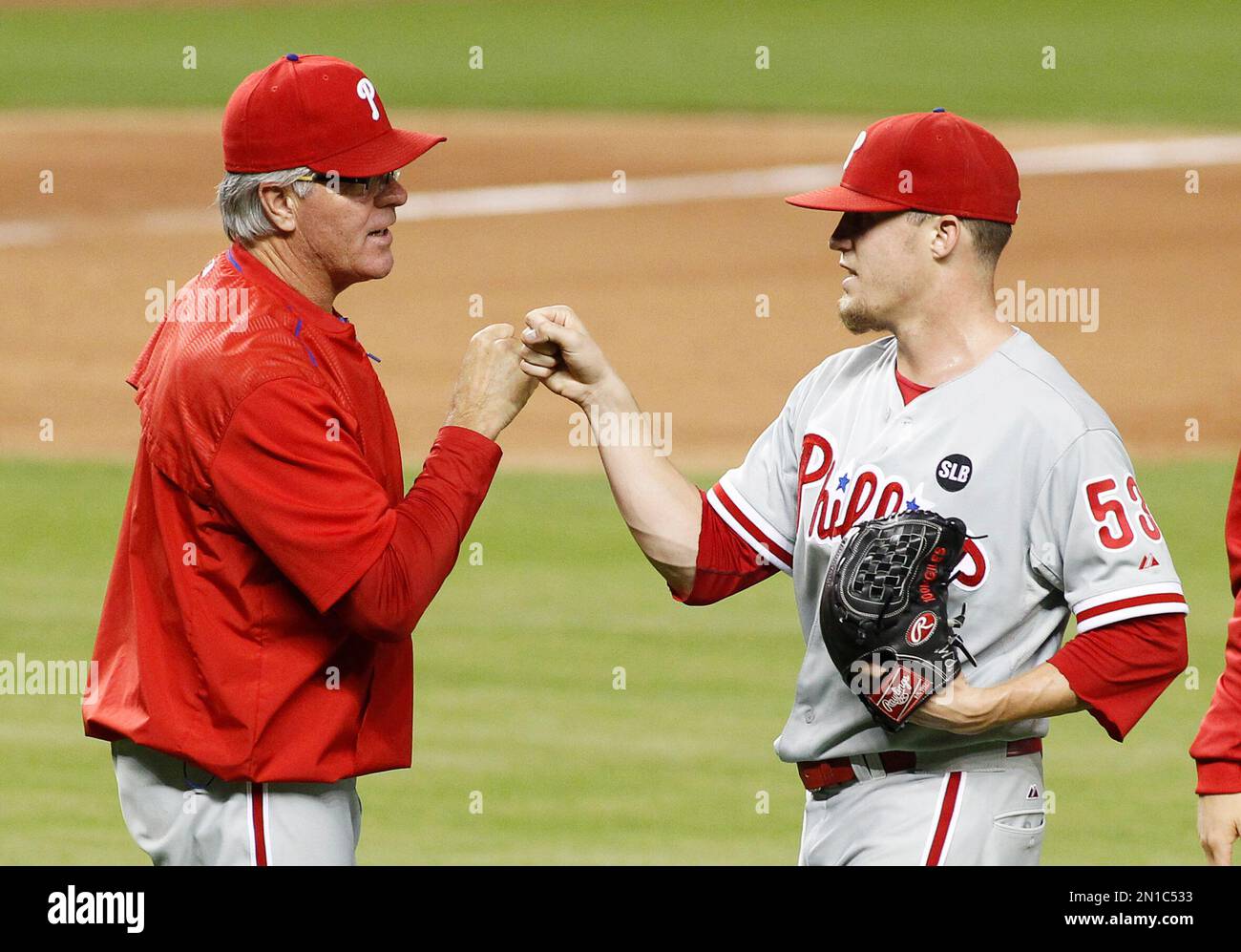Philadelphia Phillies manager Pete Mackanin, left, congratulates ...