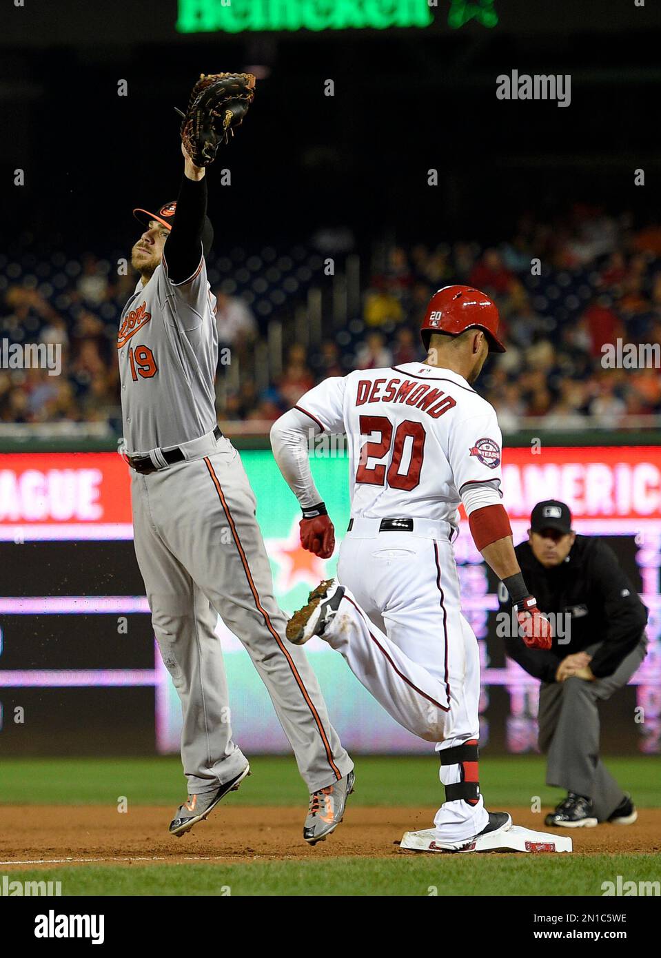 Washington Nationals' Ian Desmond (20) is safe at first as Baltimore ...