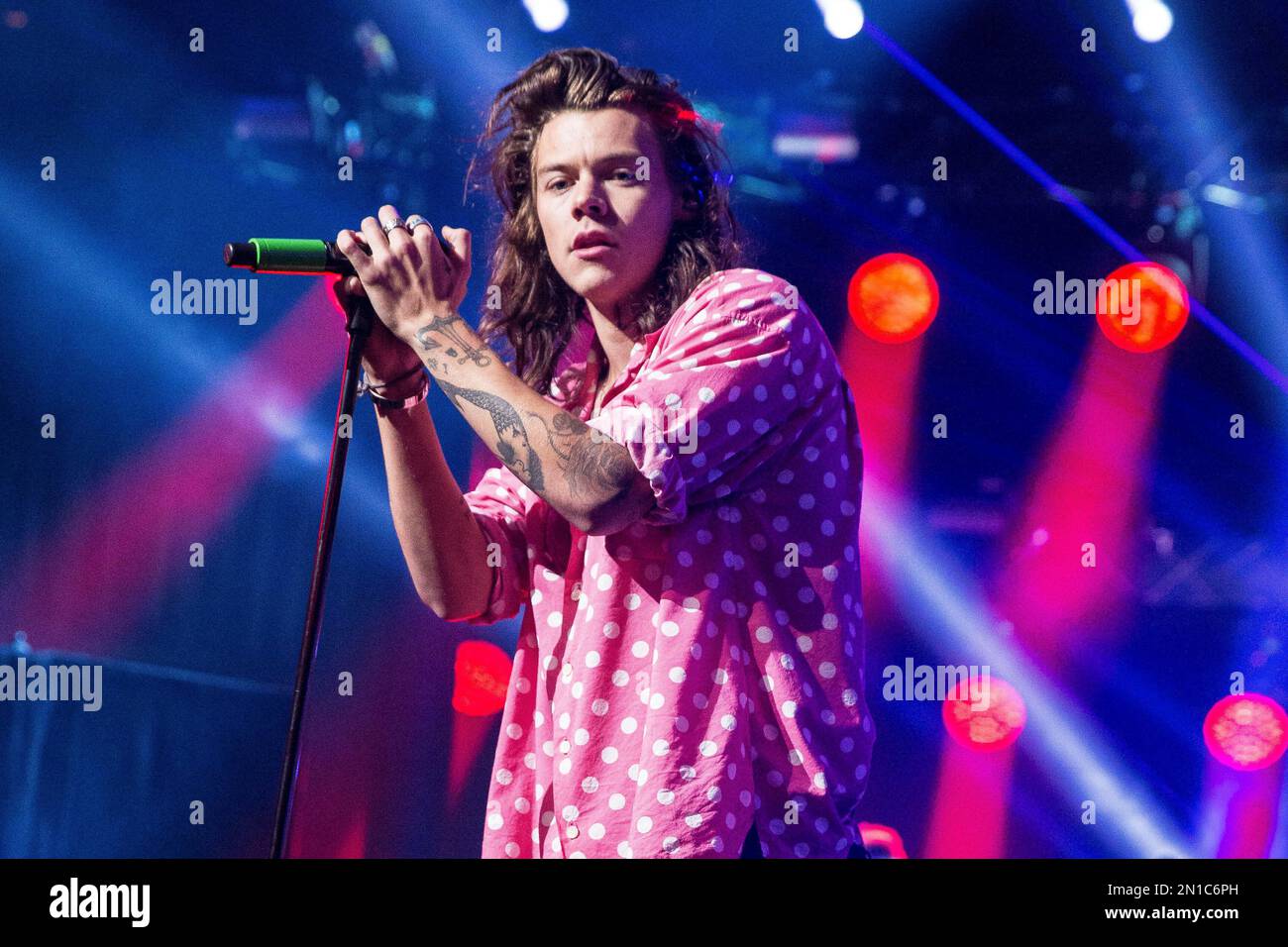 British band One Direction member Harry Styles performs on stage as ...